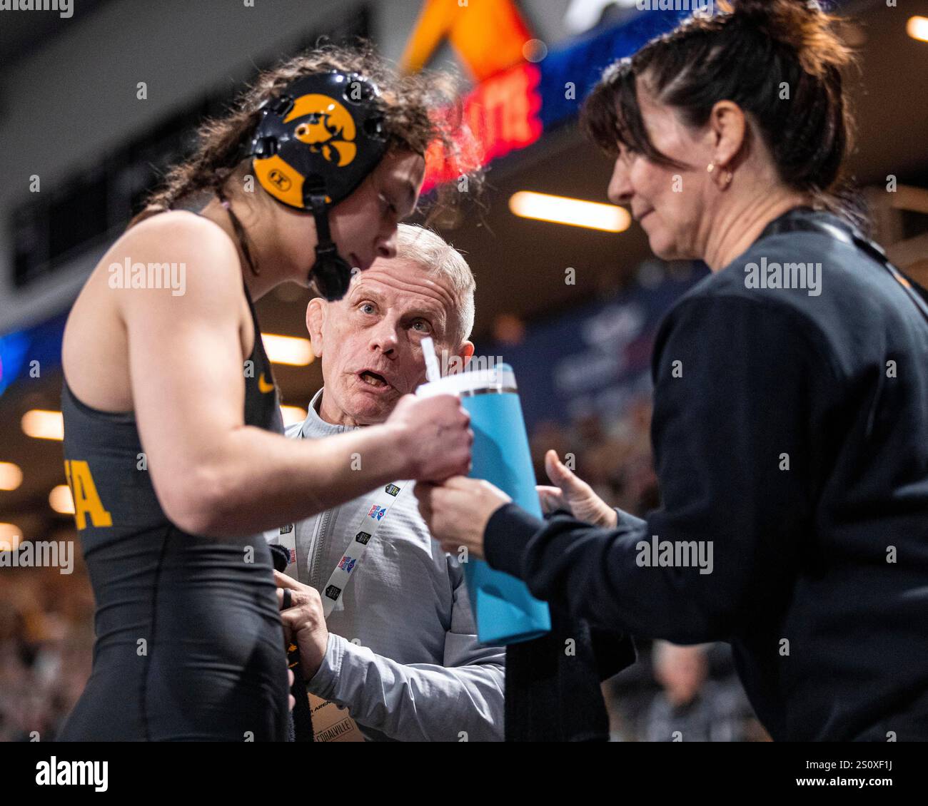 Iowa associate head coach Gary Mayabb talks with Iowa's Emily Frost ...
