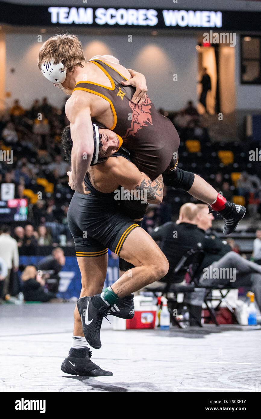 Iowa's Jesse Ybarra wrestles Wyoming's Aidan Noonan at 141 pounds ...