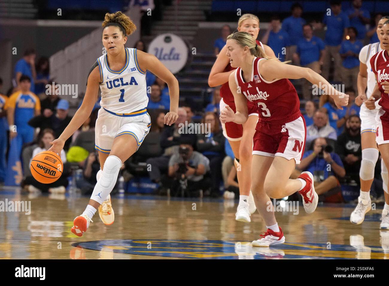 UCLA Bruins guard Kiki Rice (1) dribbles the ball against Nebraska ...