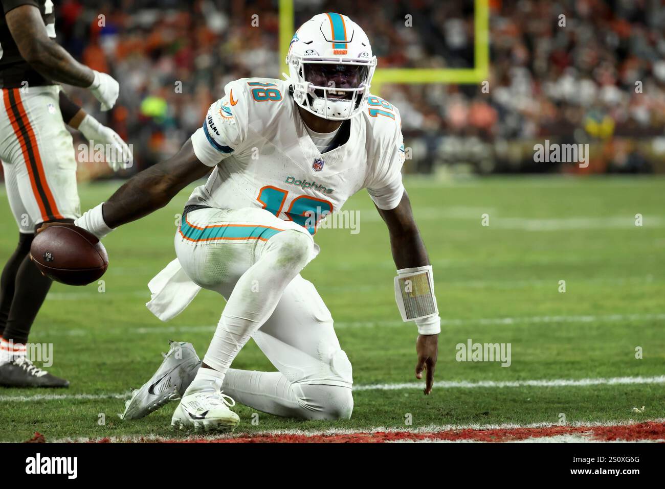 Miami Dolphins quarterback Tyler Huntley (18) reacts after scoring a ...