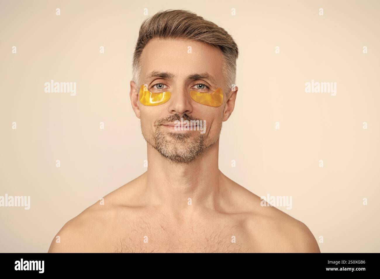 Eye patch. Beauty man face with under eye collagen pads. Mature man has ...