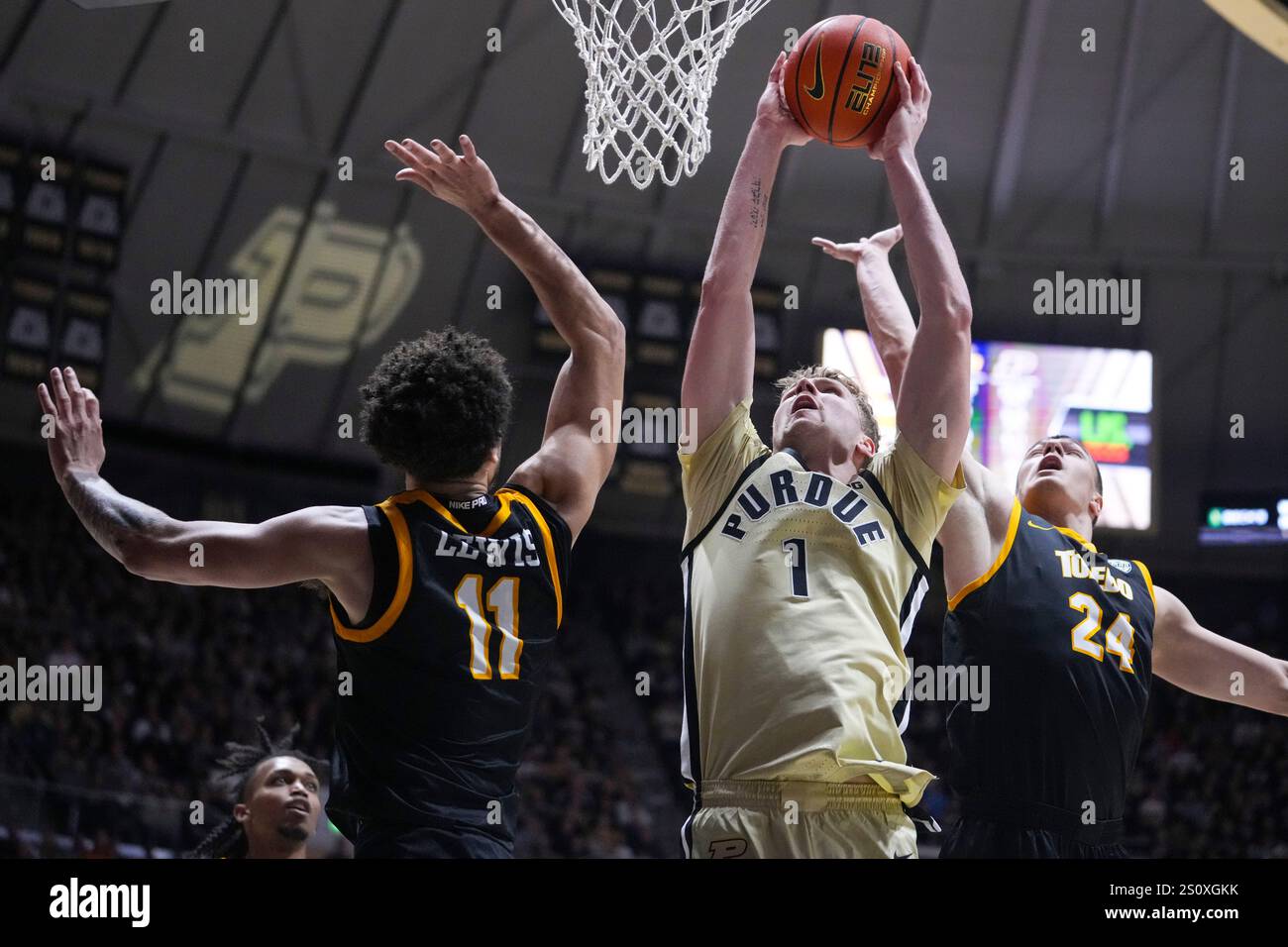 Purdue forward Caleb Furst (1) shoots between Toledo guard Sam Lewis ...