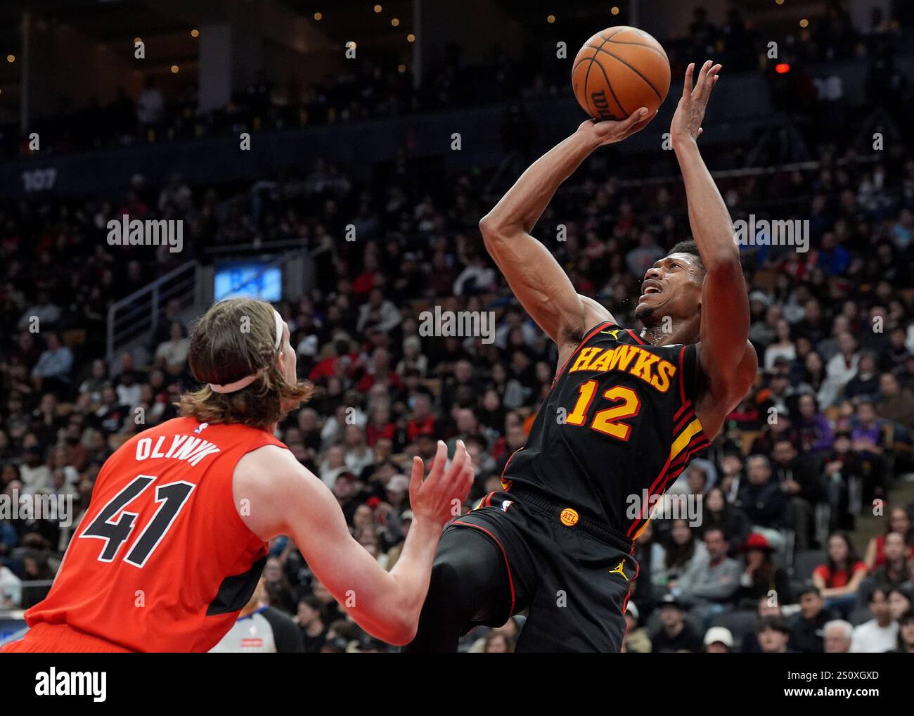 Atlanta Hawks forward De'Andre Hunter (12) looks to shoot over Toronto ...
