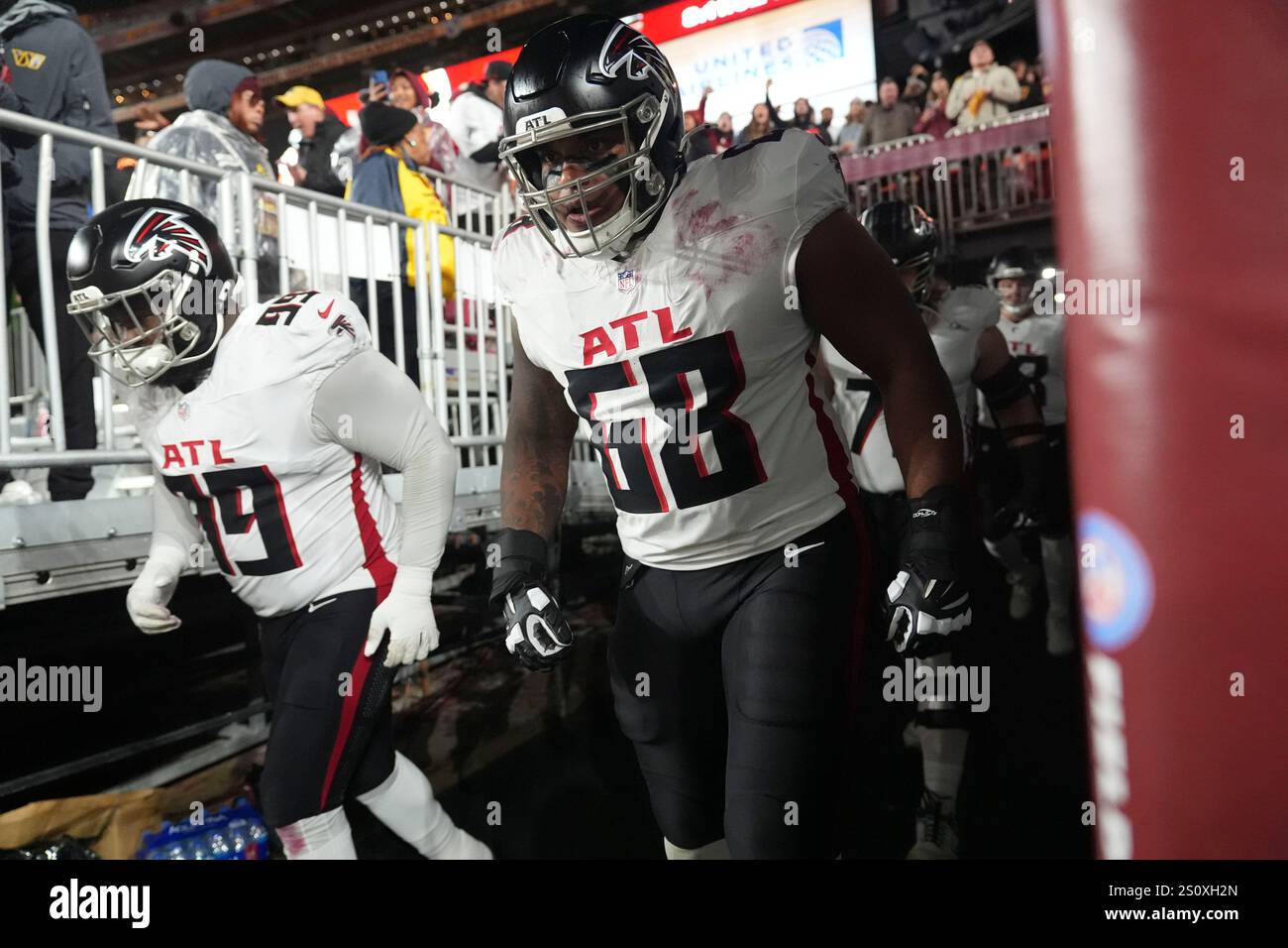 Atlanta Falcons defensive tackle Eddie Goldman (99) and guard Kyle ...