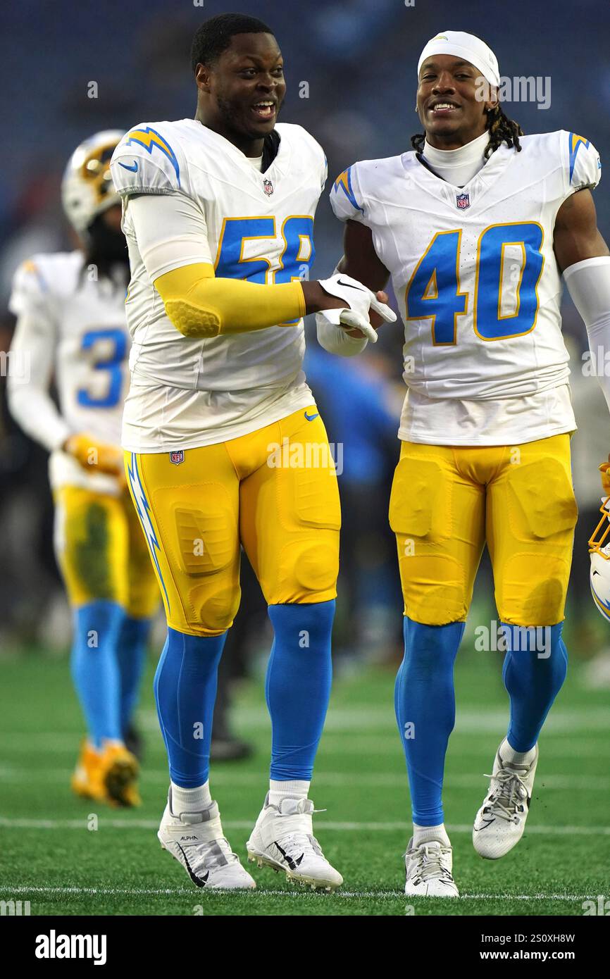 Los Angeles Chargers linebacker Shaq Quarterman (58) and safety Kendall Williamson (40) after an ...