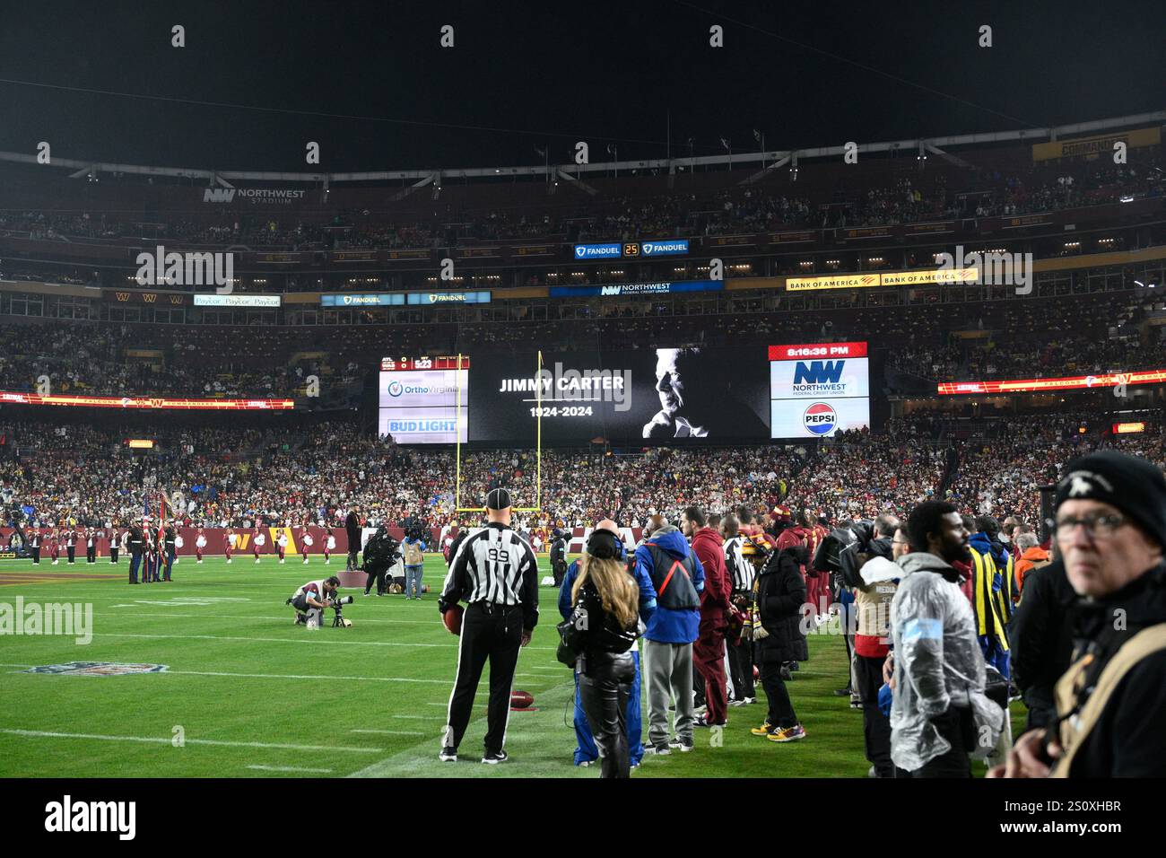A video tribute to former President Jimmy Carter is seen before an NFL ...