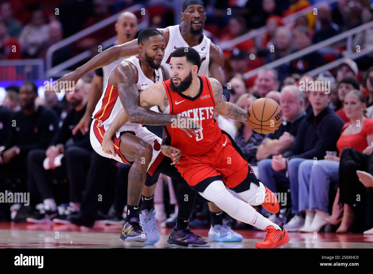 Houston Rockets guard Fred VanVleet (5) drives around Miami Heat forward Haywood Highsmith, left ...