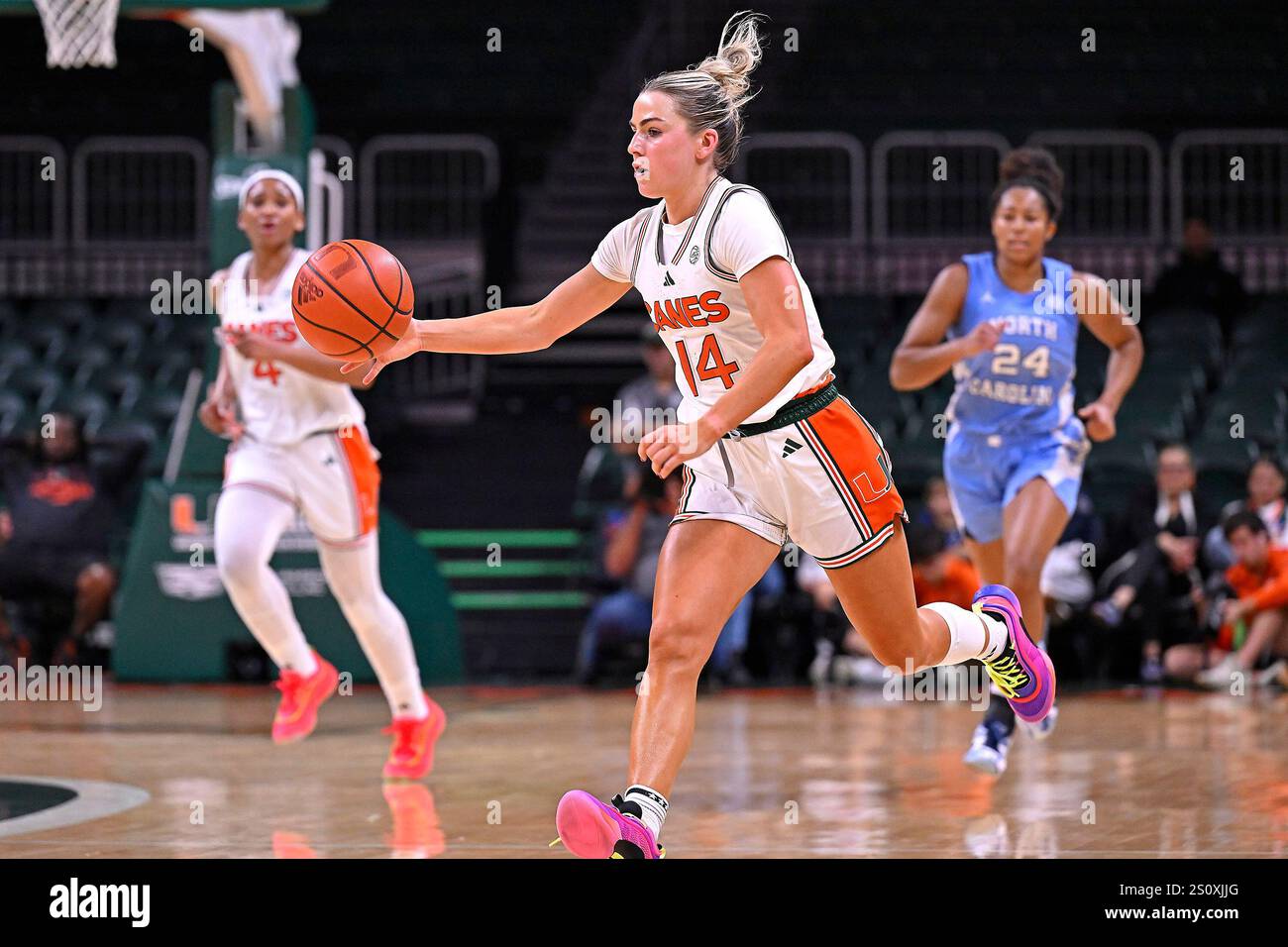CORAL GABLES, FL - DECEMBER 29: Miami guard Haley Cavinder (14) brings ...