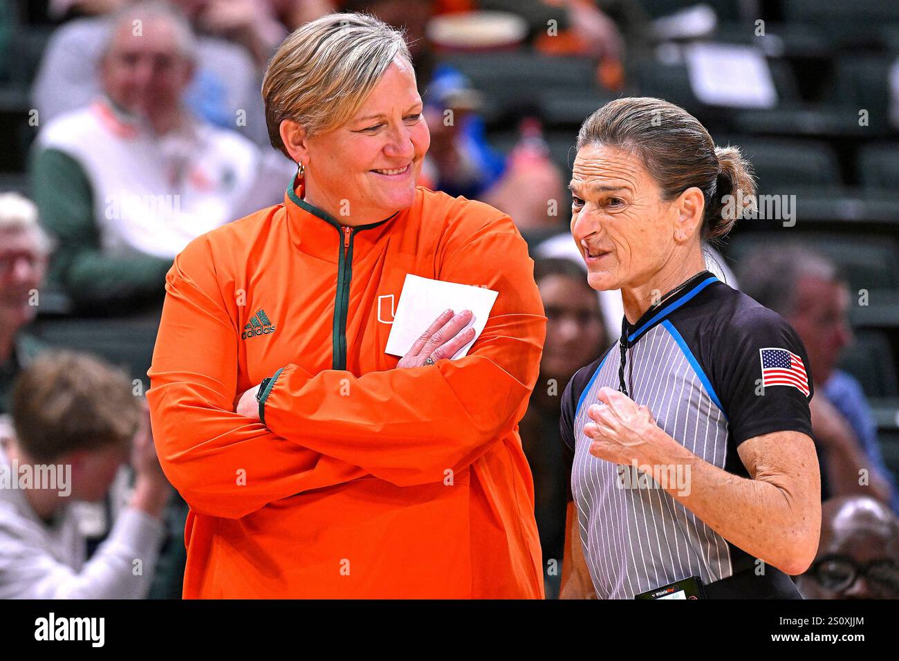 CORAL GABLES, FL - DECEMBER 29: Miami Head Coach Tricia Cullop enjoys a ...