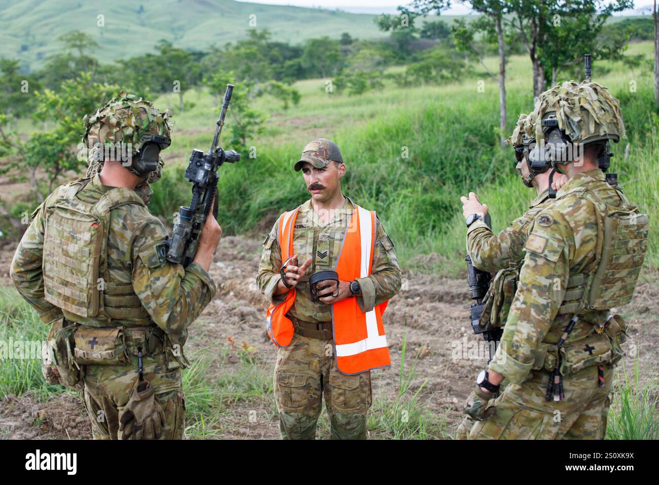 Australian Defense Force members receive squad tactics instruction during Exercise Keris Strike ...