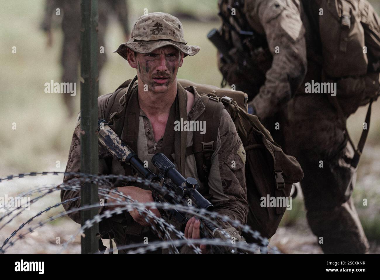 A U.S. Marine participates in the final assault objective along with ...