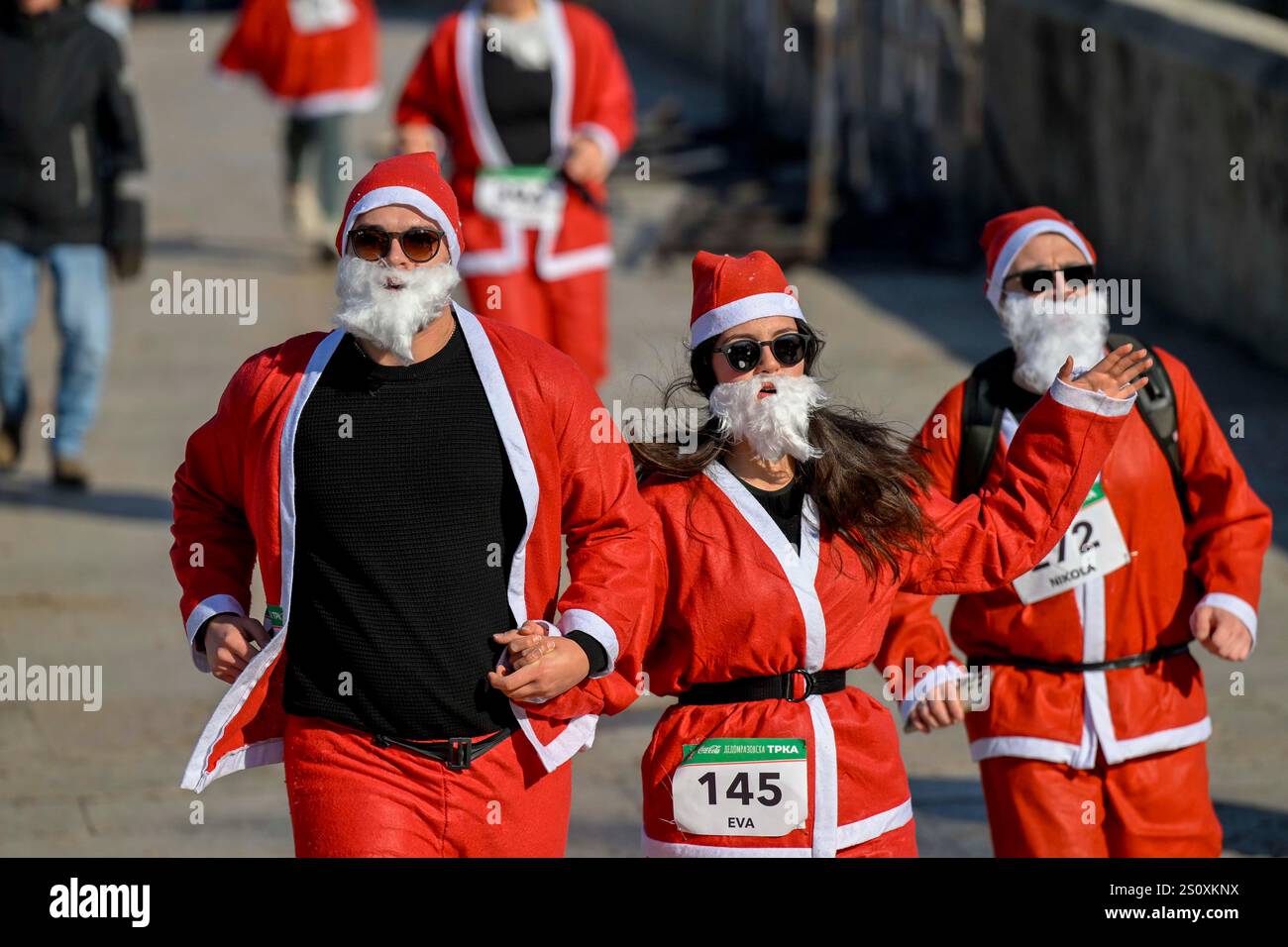 Skopje, North Macedonia. 29th Dec, 2024. People dressed as Santa ...