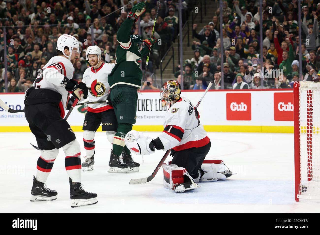 Minnesota Wild center Yakov Trenin, center right, celebrates after his ...