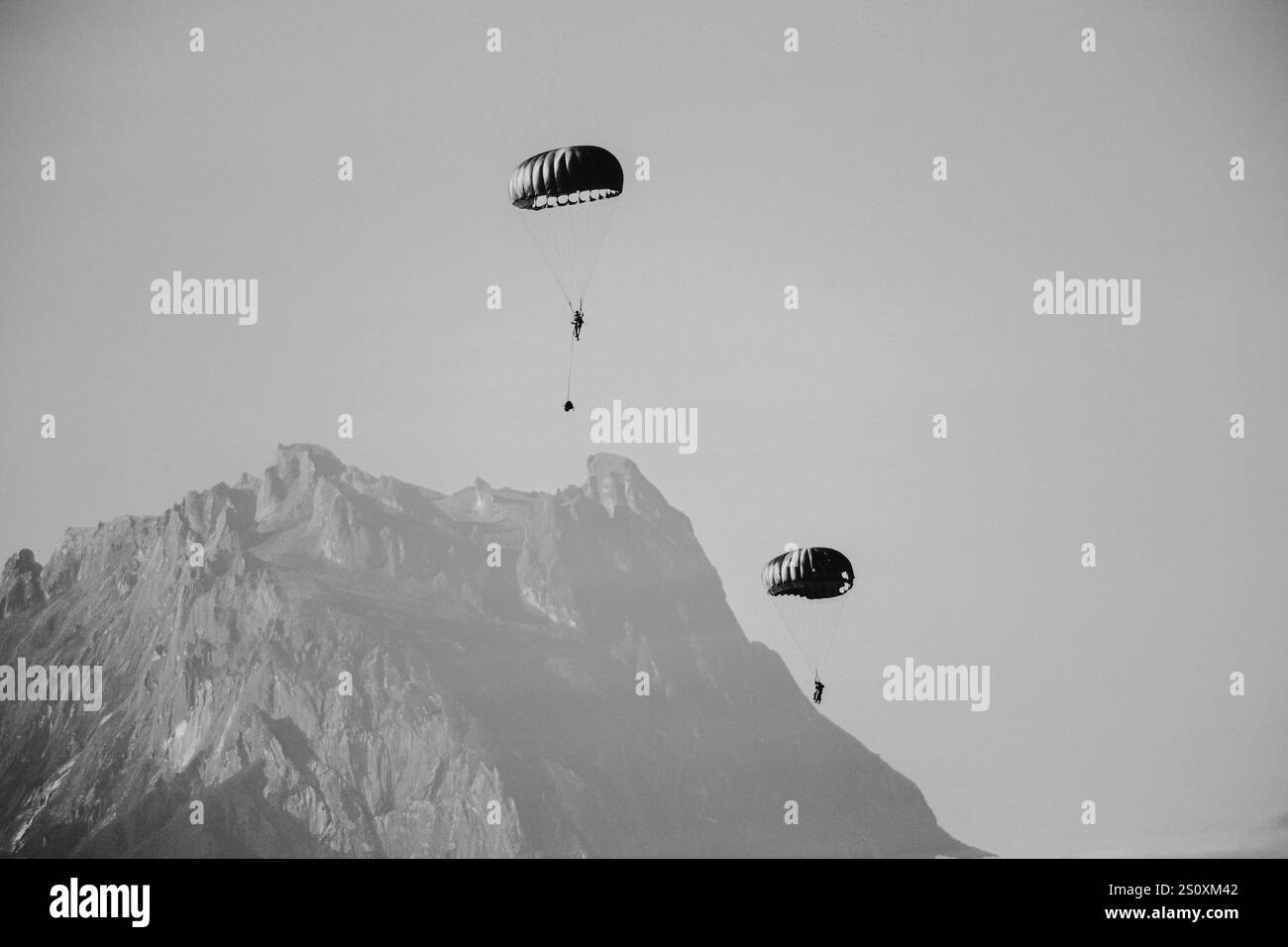 Members of a Malaysian Armed Forces airborne unit parachute onto a ...