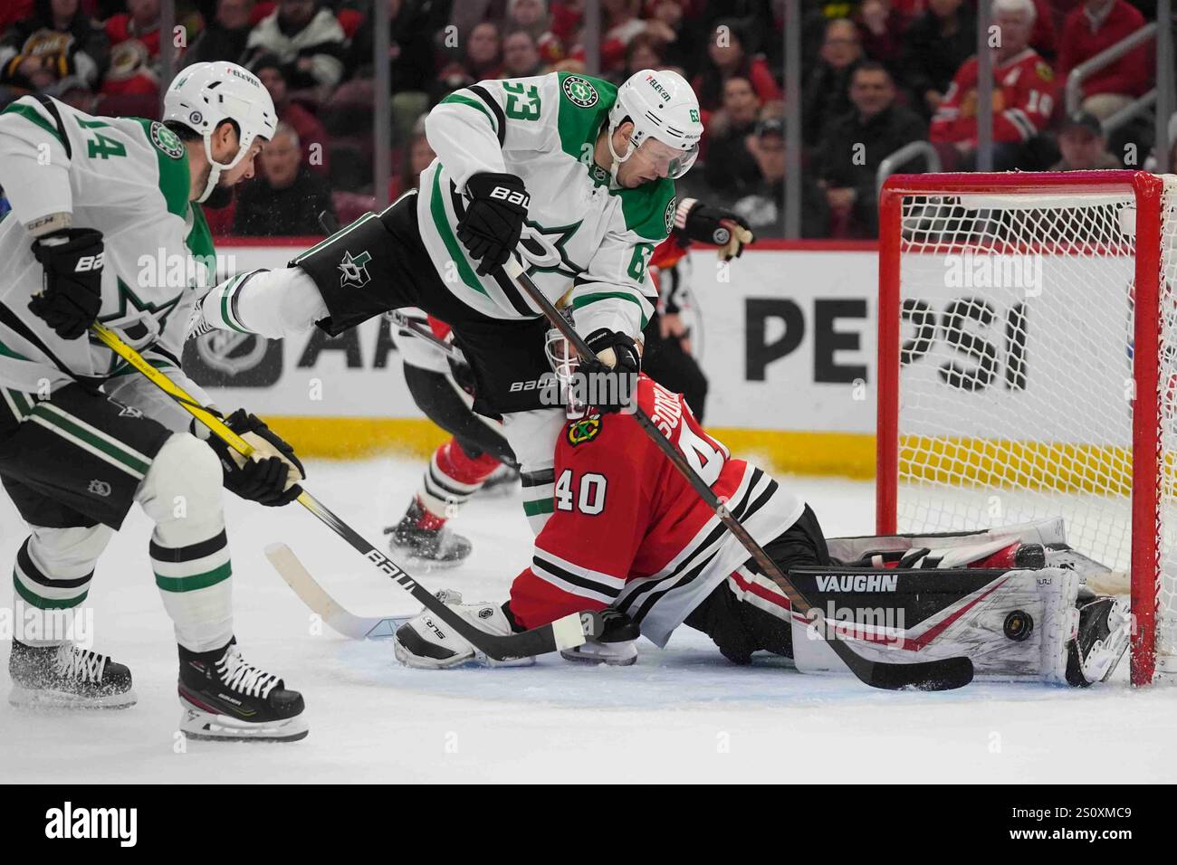 Chicago Blackhawks goaltender Arvid Soderblom (40) makes a save against ...