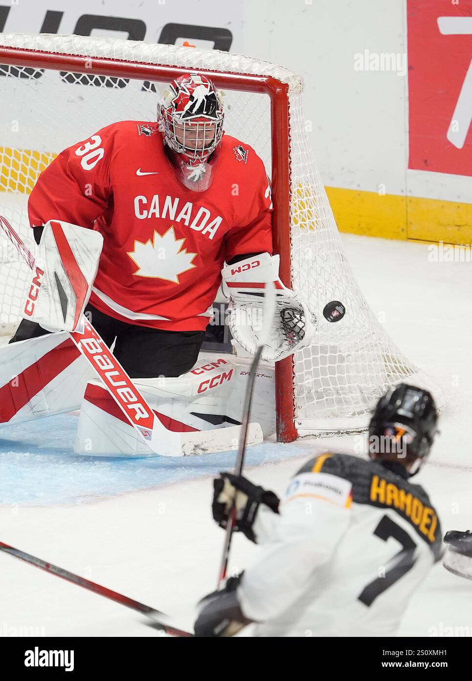 Ottawa, Canada. 29th Dec, 2024. Canada goaltender Carter George cuts ...