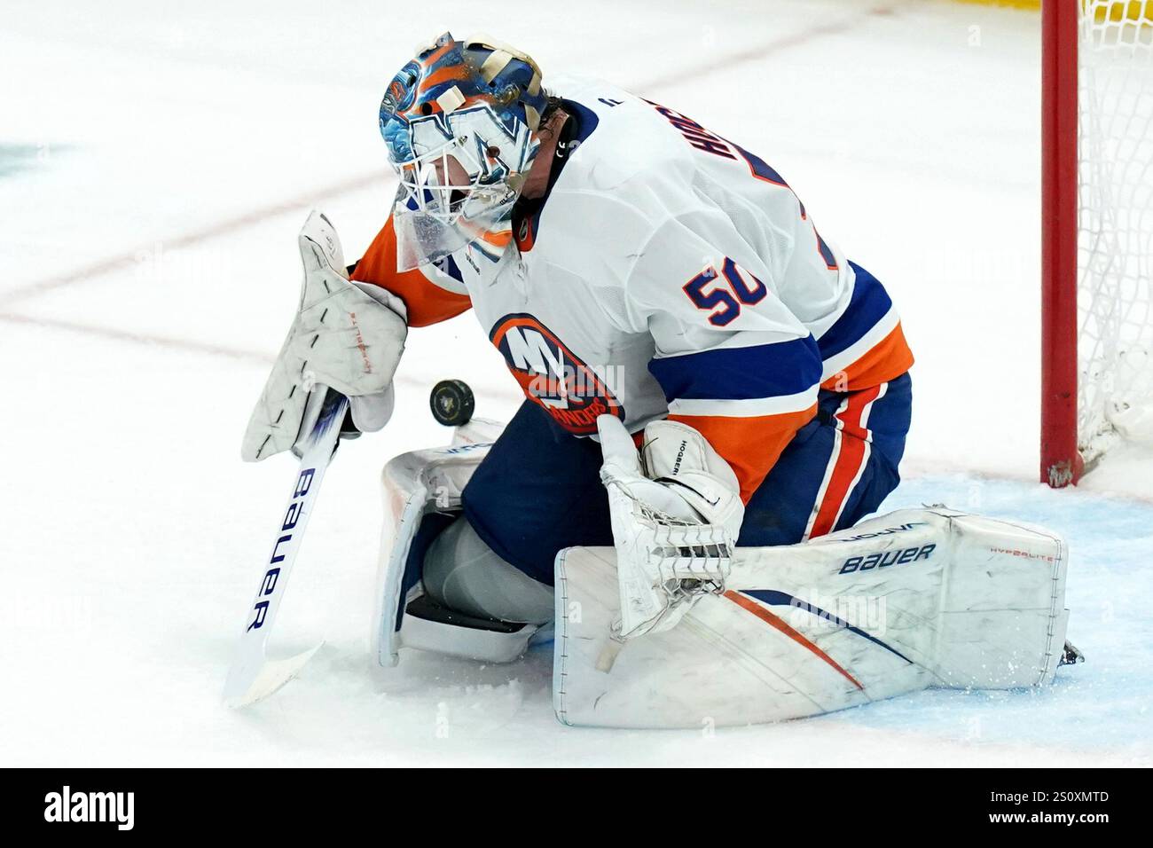 New York Islanders goaltender Marcus Hogberg (50) makes a save during ...