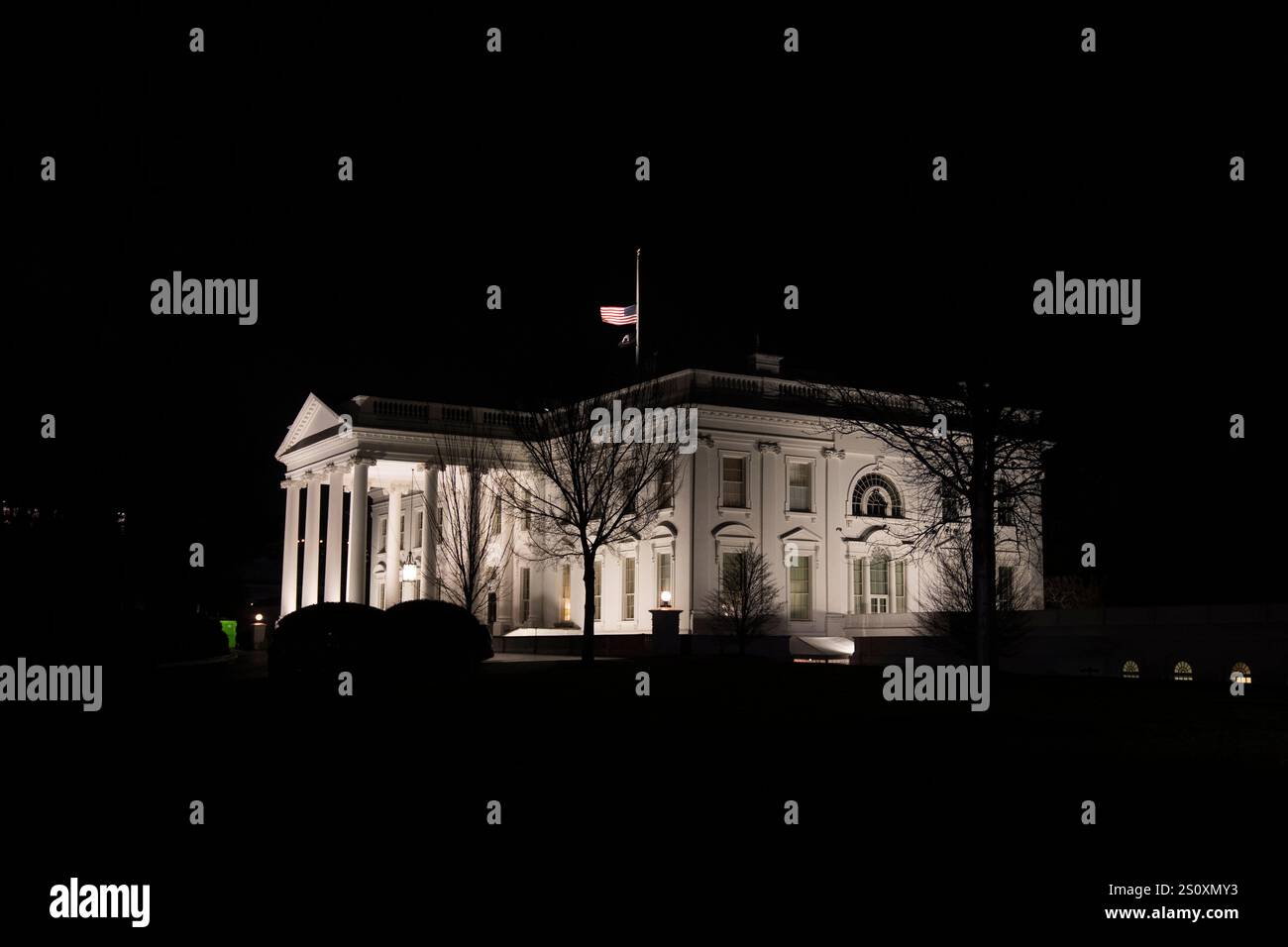 The American flag flies at half-staff for the late President Jimmy ...