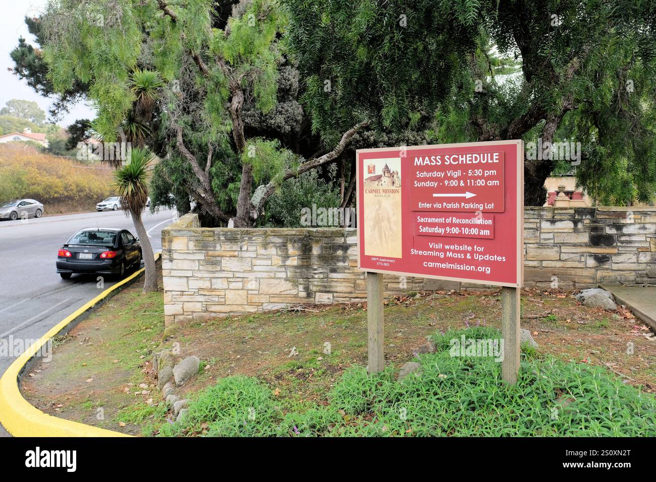 Sign at the historic Carmel Mission Basilica, built in 1797, with hours ...