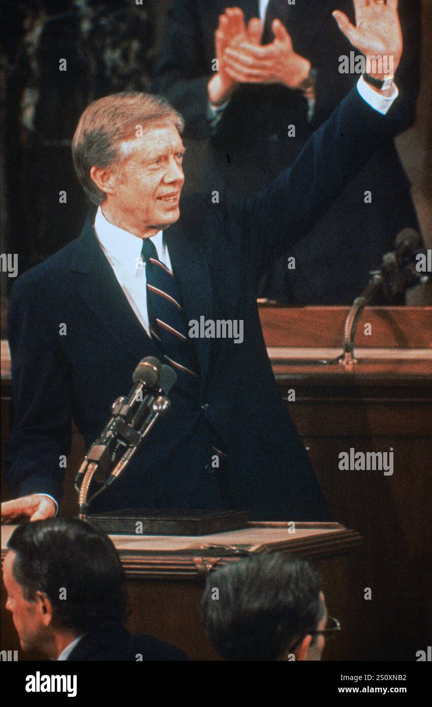 United States President Jimmy Carter waves to the gallery as he ...