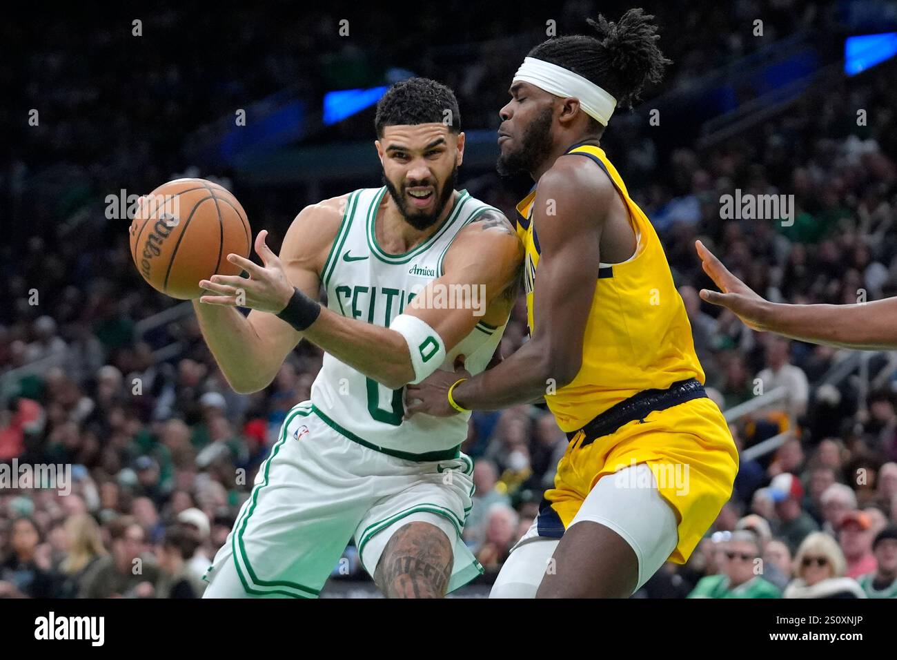 Boston Celtics forward Jayson Tatum (0) drives past Indiana Pacers ...
