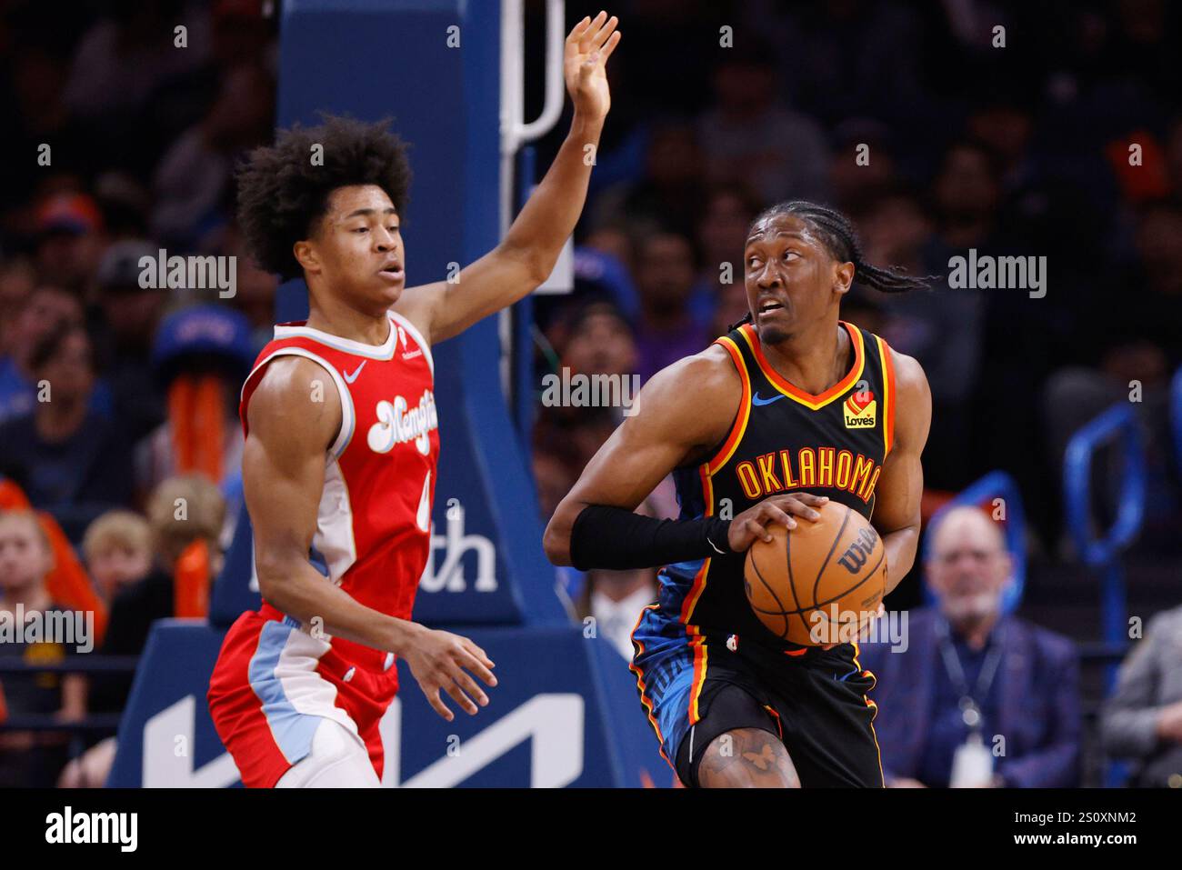 Oklahoma City Thunder forward Jalen Williams, right, spins to the ...