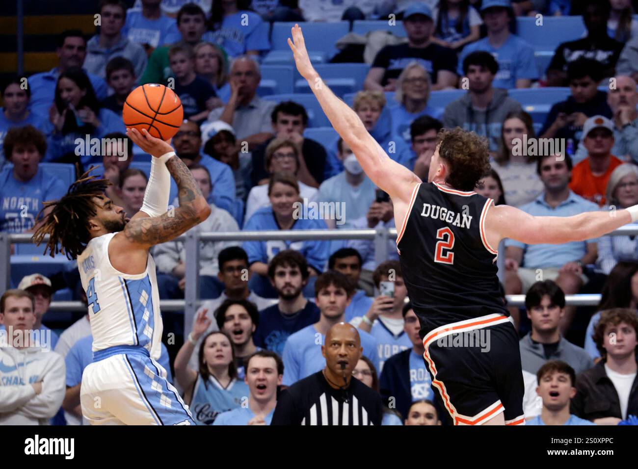North Carolina guard RJ Davis (4) shoots over Campbell forward Colby ...
