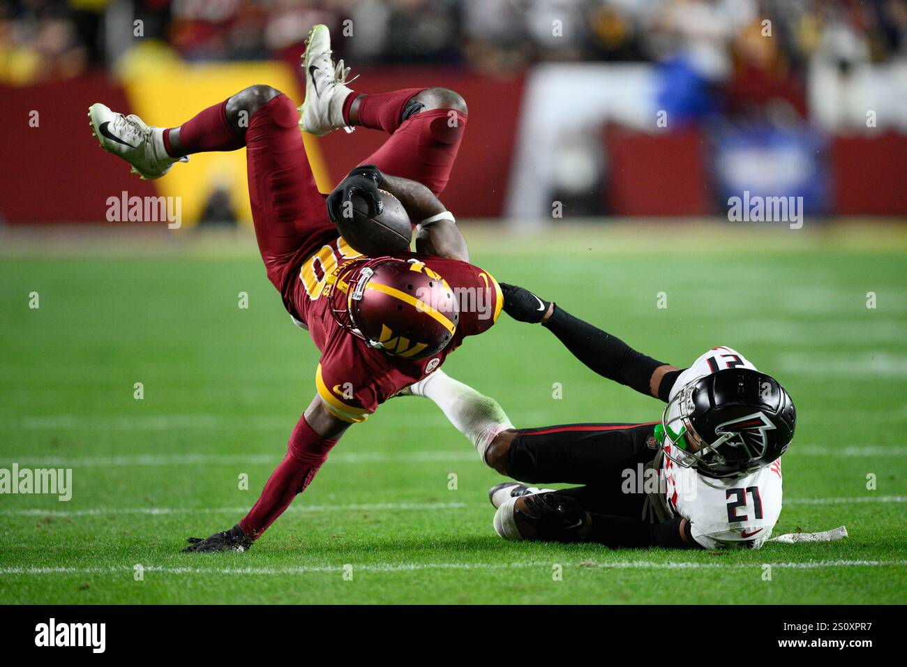 Washington Commanders wide receiver Jamison Crowder is tackled by ...