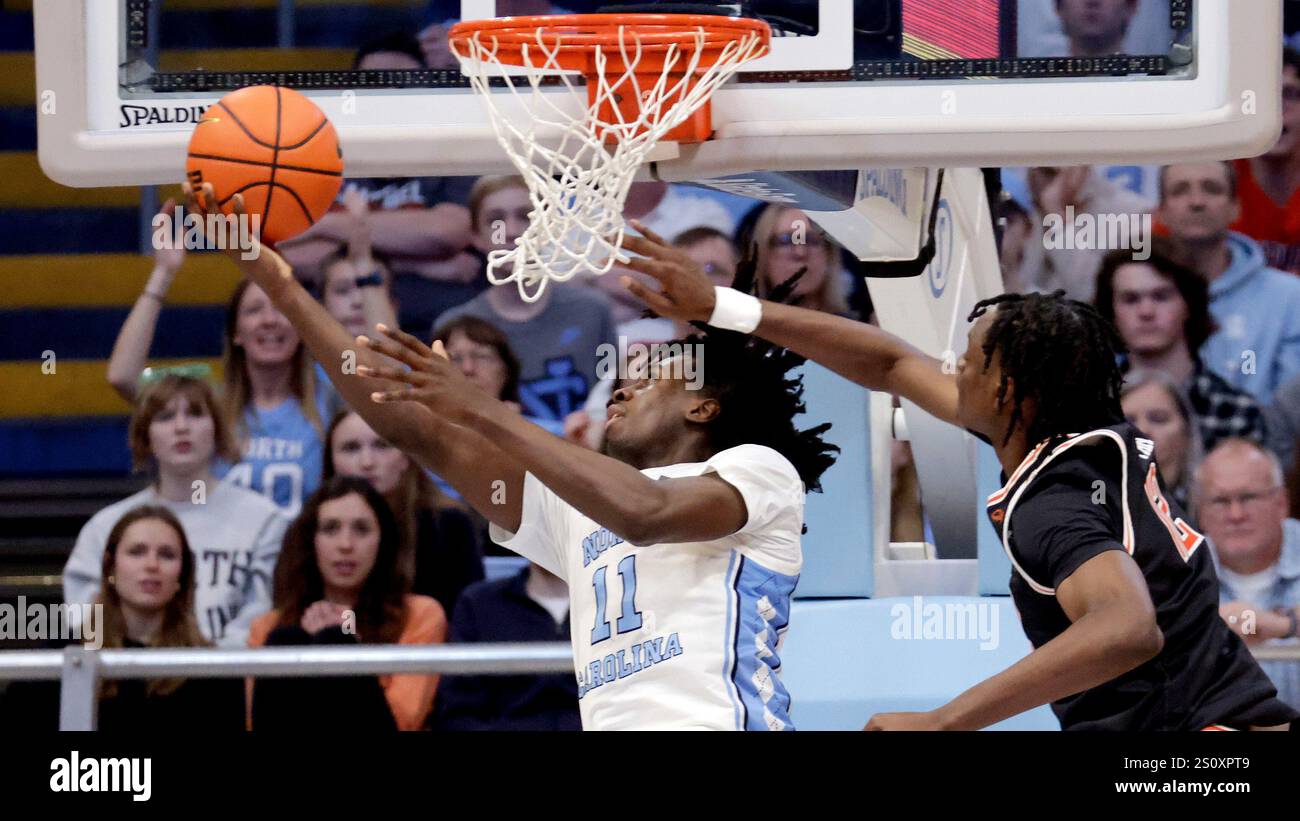 North Carolina guard Ian Jackson (11) drives against Campbell forward ...