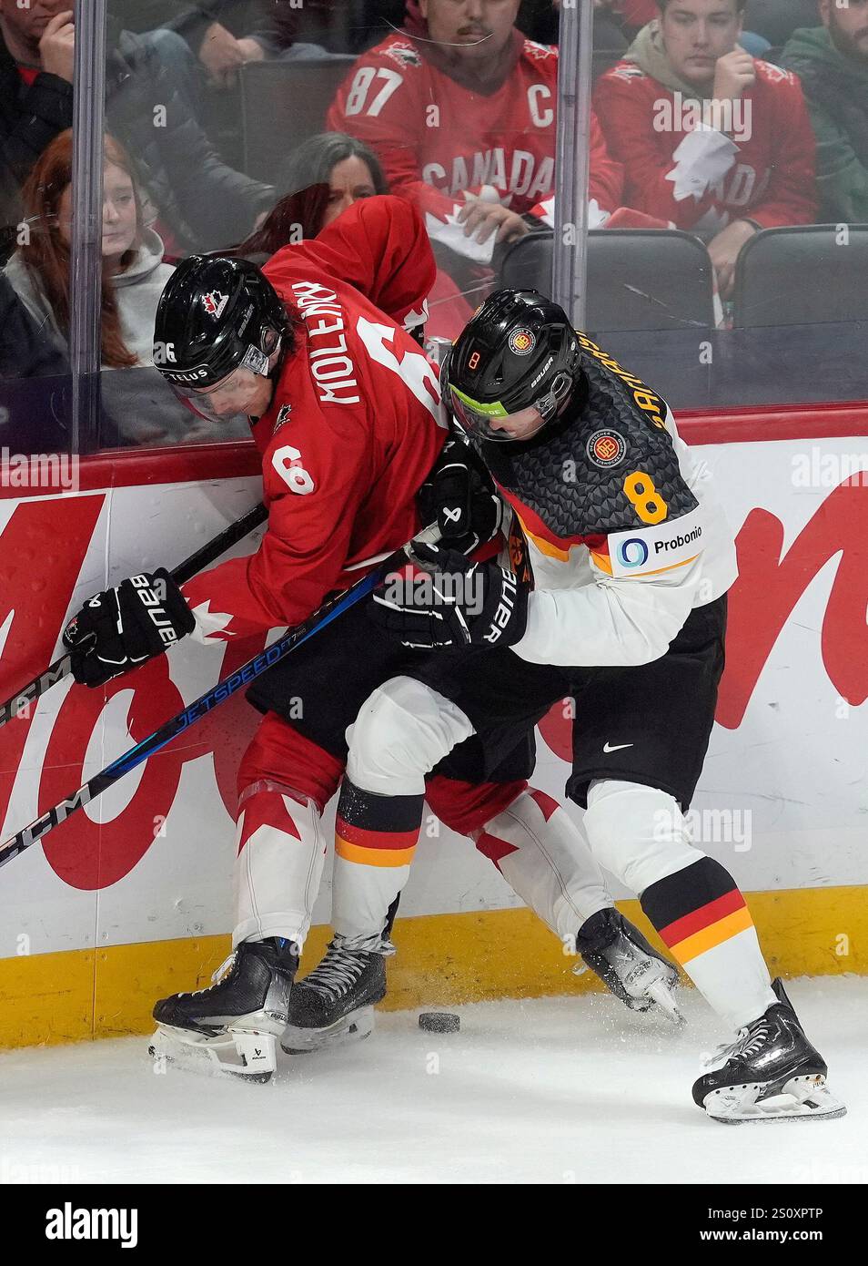 Canada defenceman Tanner Molendyk (6) and Germany forward Noah Samanski ...