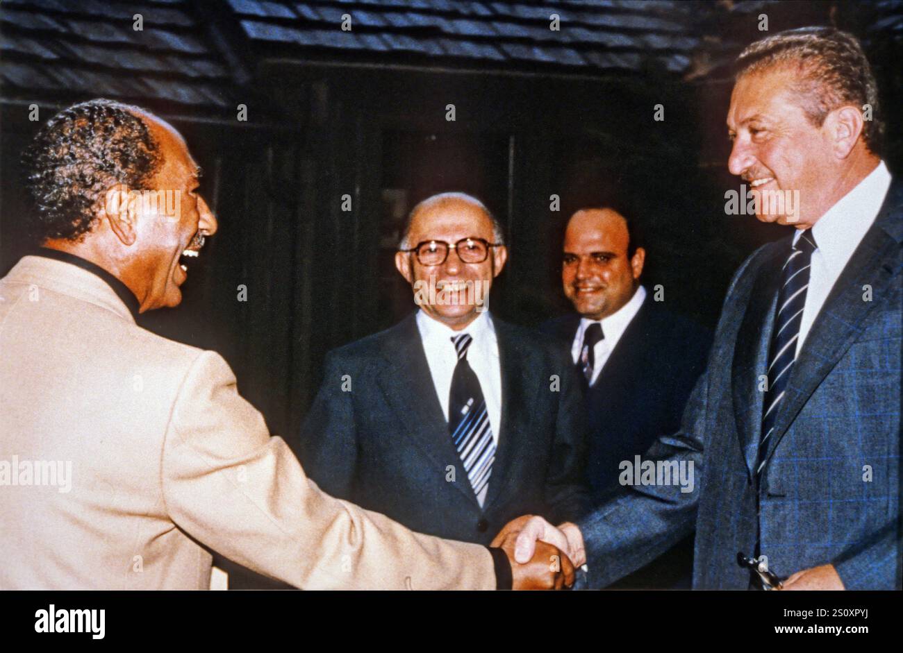 President Anwar al-Sadat of Egypt, left, shakes hands with Defense ...