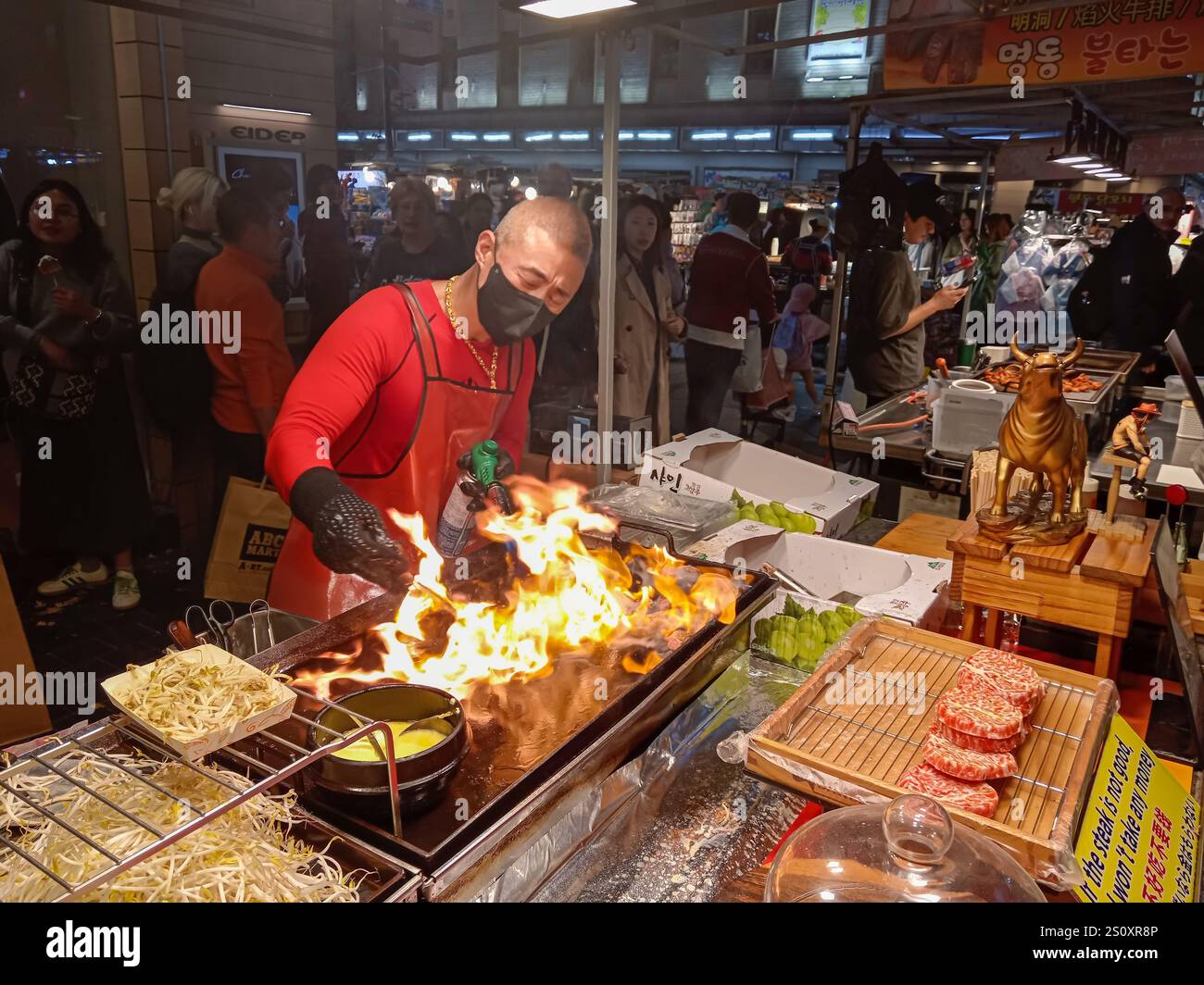 Seoul, South Korea - October 28, 2024: Street scene of man cooking ...