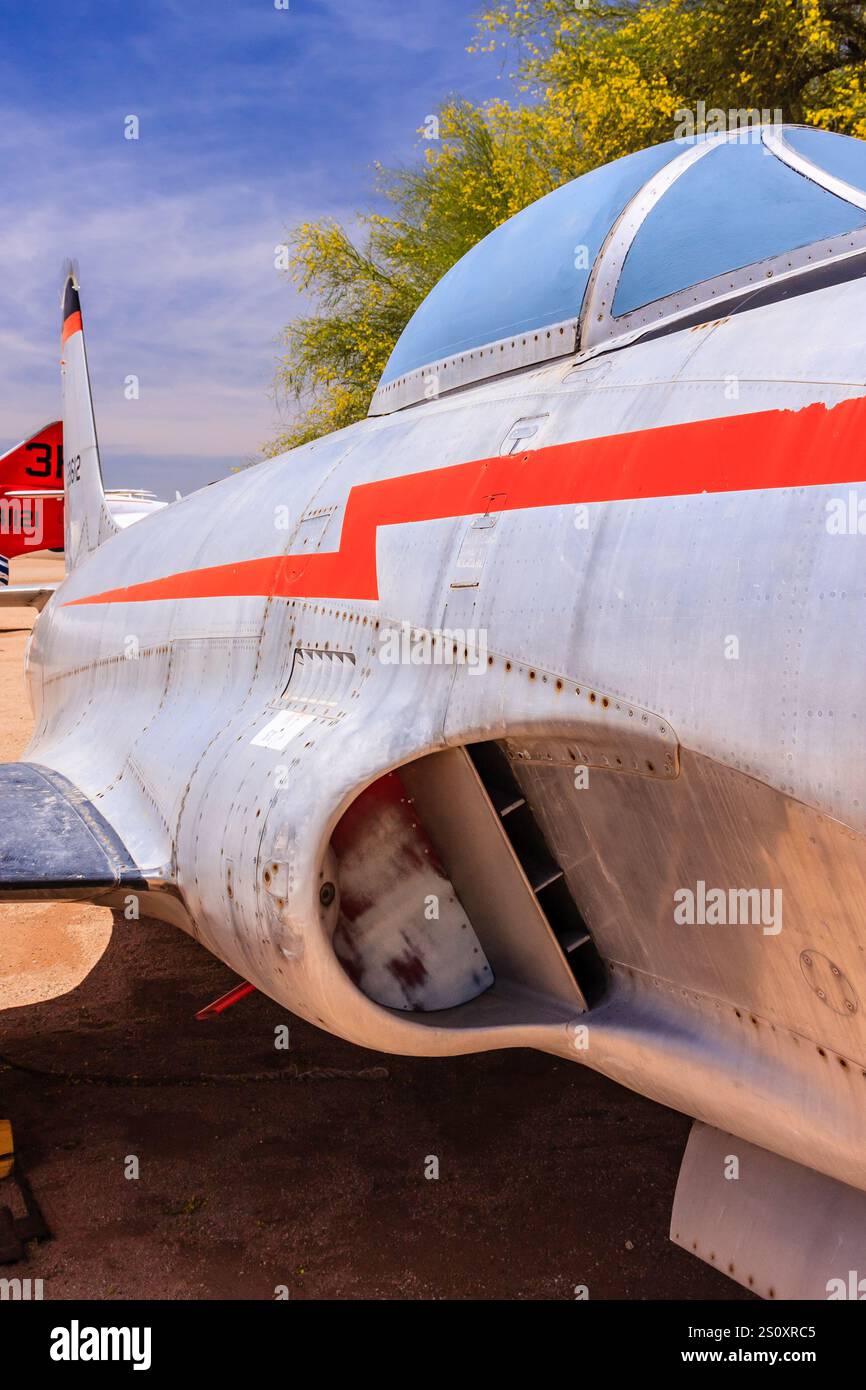 A silver and red plane with the number 31 on the tail. The plane is ...