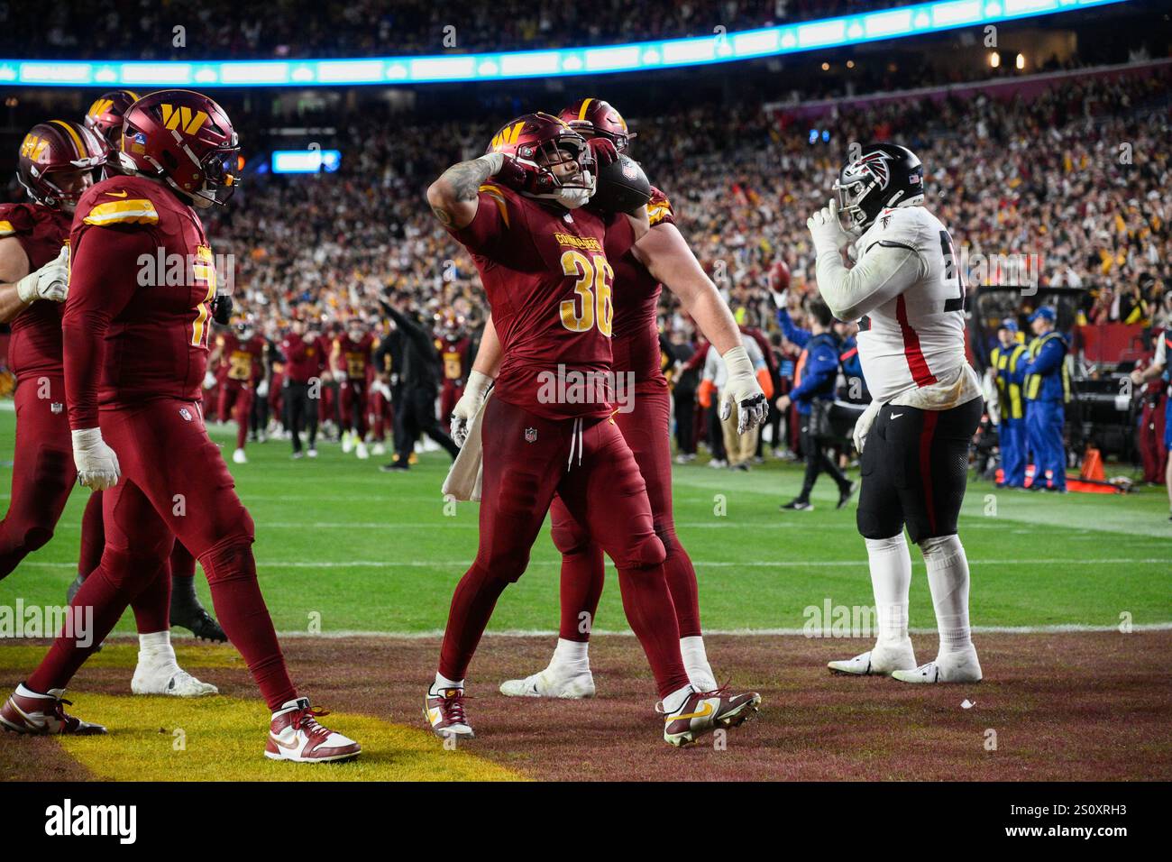 ]Washington Commanders running back Chris Rodriguez Jr. (36) celebrates ...
