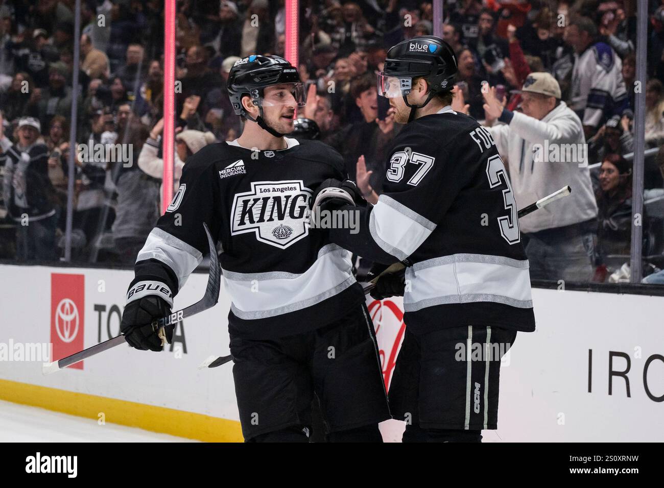 Los Angeles Kings left wing Warren Foegele (37) celebrates with left ...