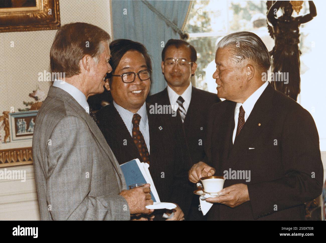 United States President Jimmy Carter, left, enjoys tea in the Blue Room ...