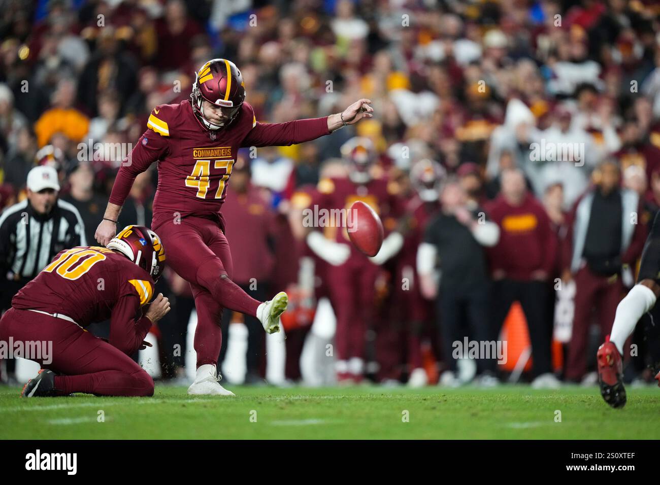 Washington Commanders place kicker Zane Gonzalez (47) kicks a field ...
