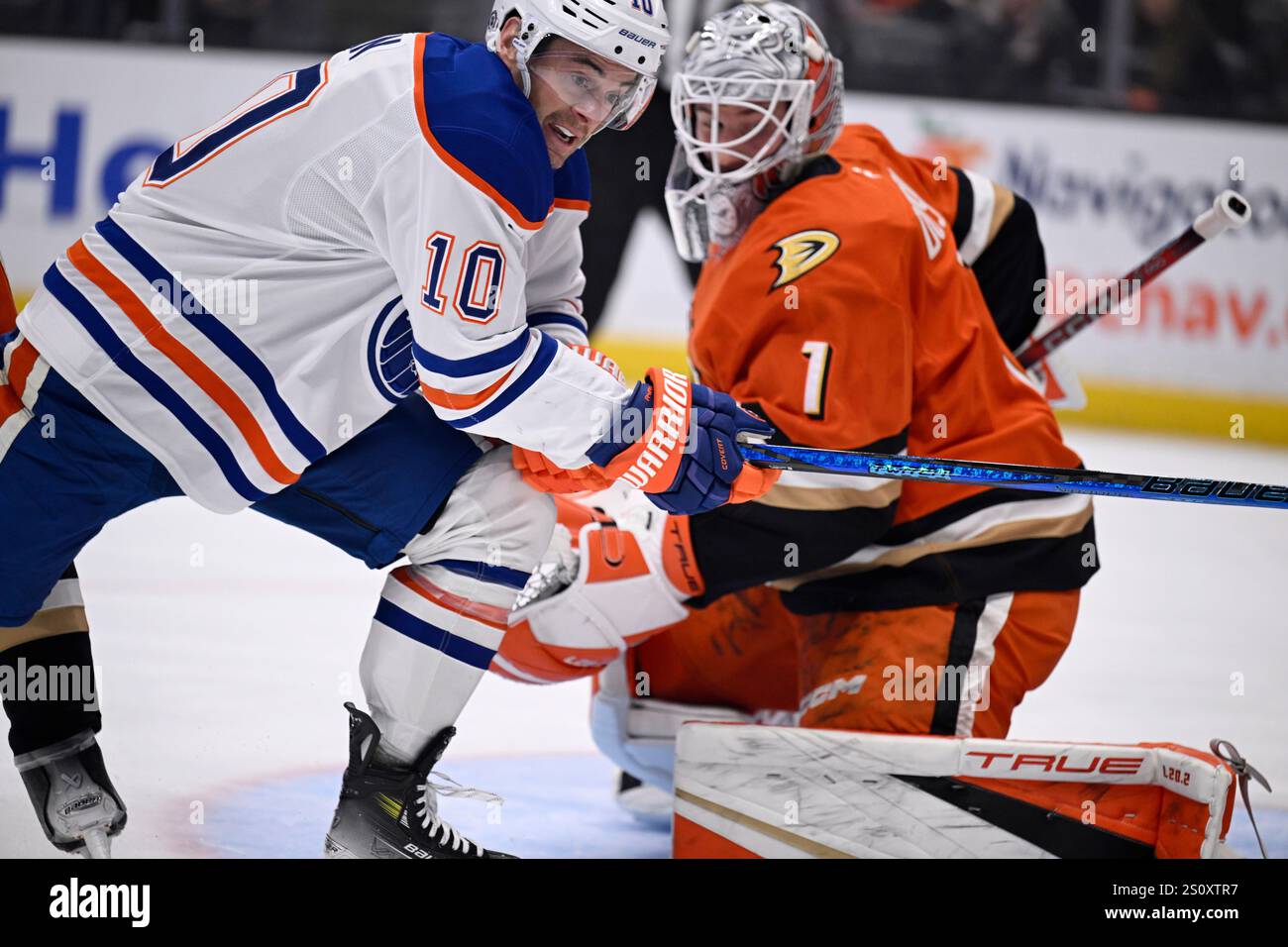 Edmonton Oilers center Derek Ryan (10) and Anaheim Ducks goaltender Lukas Dostal (1) watch the ...
