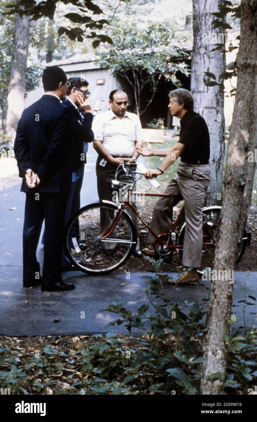United States President Jimmy Carter, right, interrupts a ride on his ...