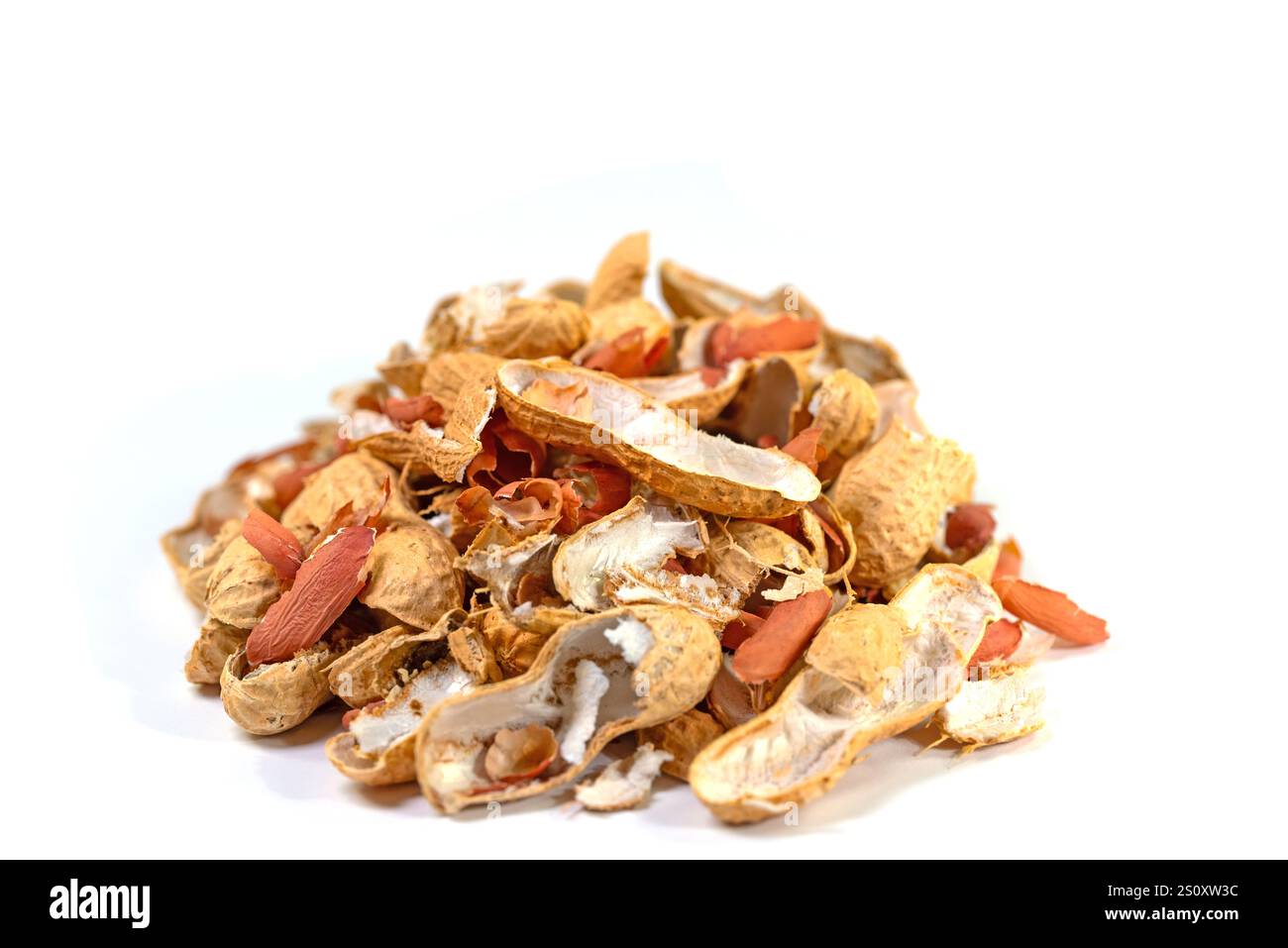 Peanut shells against a white background Stock Photo - Alamy