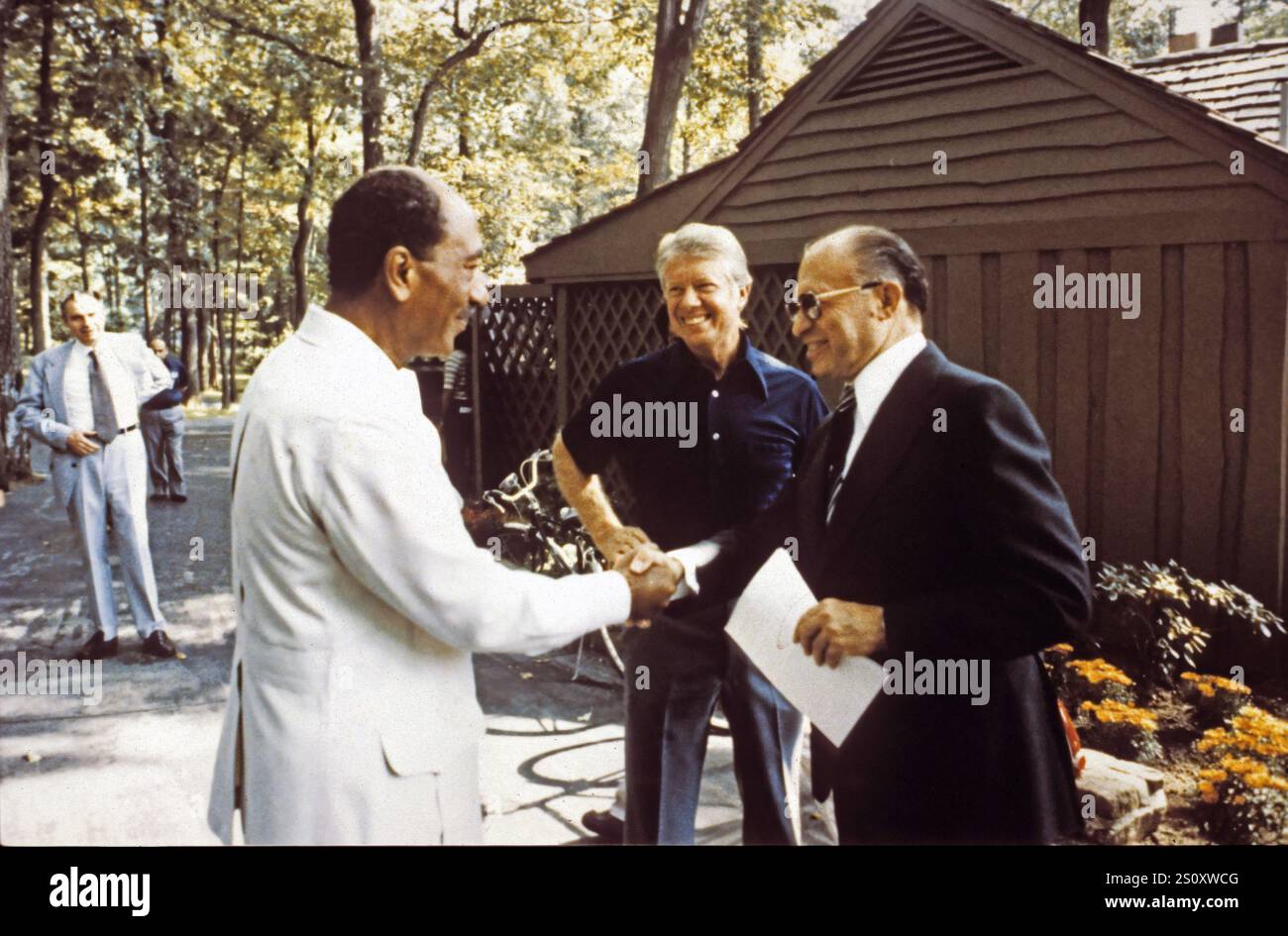 President Anwar al-Sadat of Egypt, left, shakes hands with Prime ...