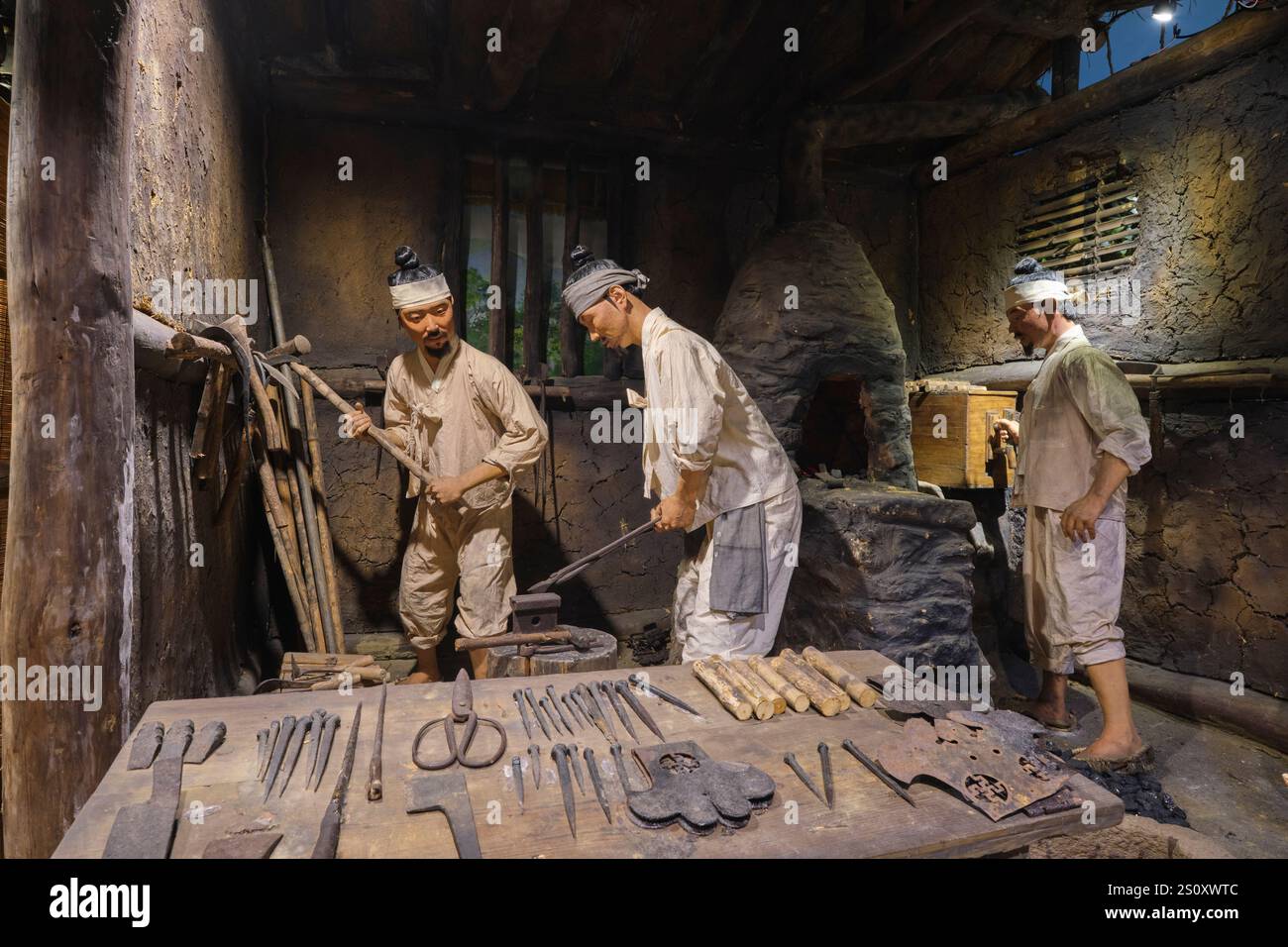 Workers at a blacksmith, metal shop. At the Agricultural Museum in ...