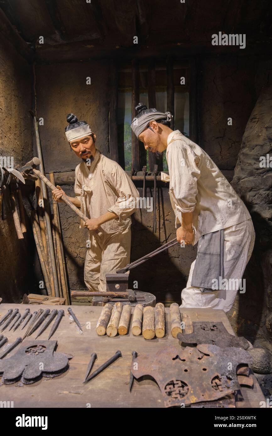 Workers at a blacksmith, metal shop. At the Agricultural Museum in ...
