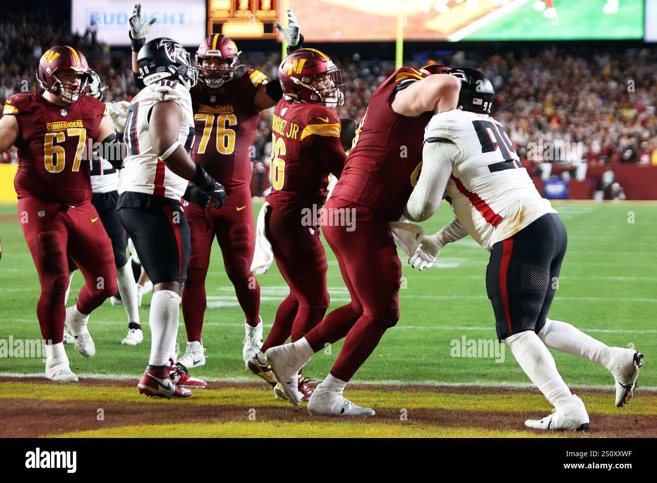 Washington Commanders running back Chris Rodriguez Jr. (36) scores a ...