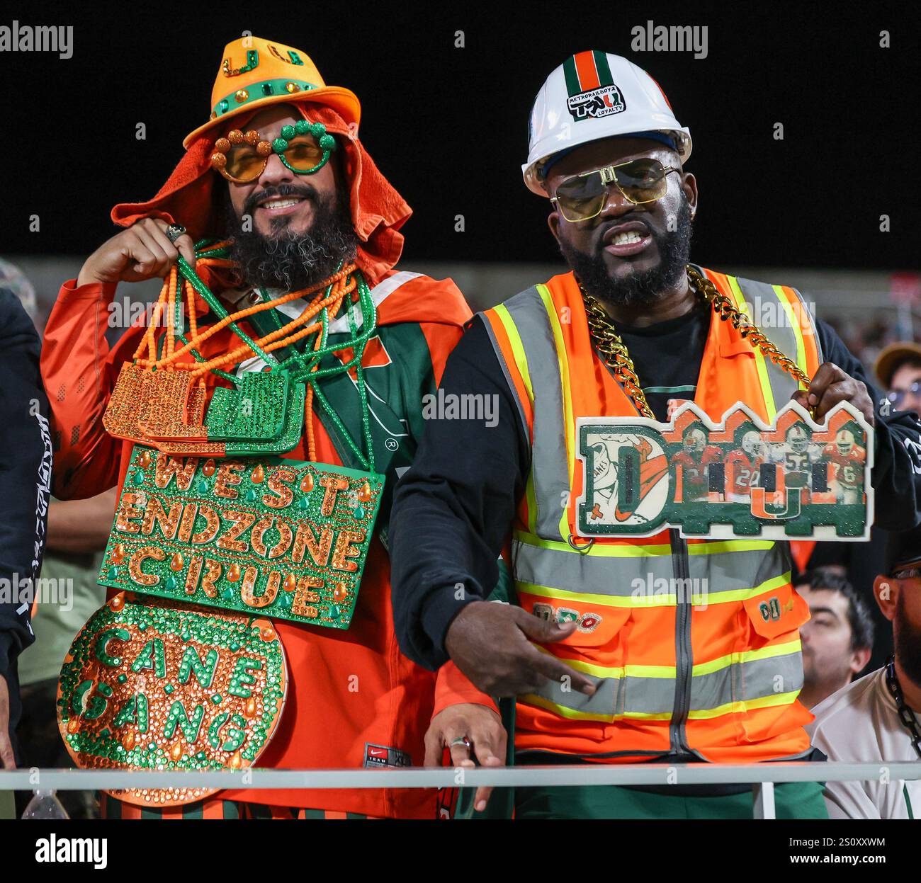 Orlando, FL, USA. 28th Dec, 2024. Miami fans show off their fan gear ...