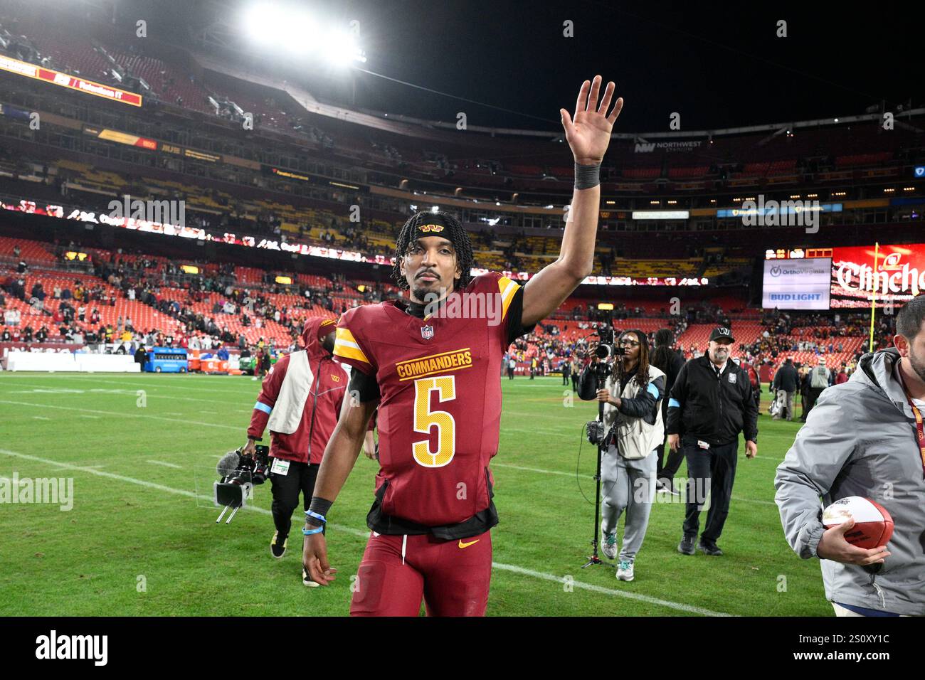 Washington Commanders quarterback Jayden Daniels (5) waves to the crowd ...