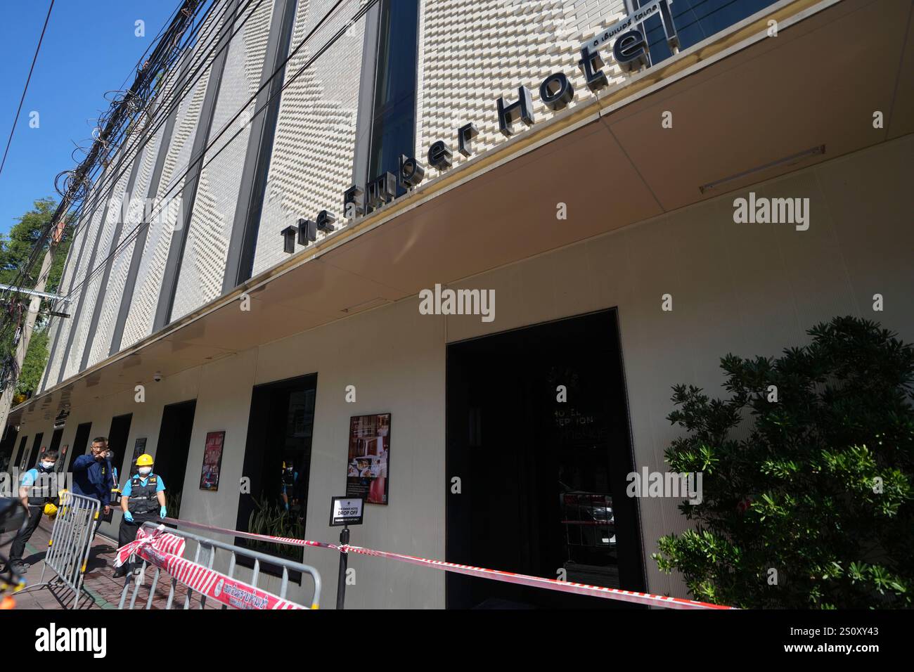 Police forensics team arrive at a hotel in Bangkok, Thailand, Monday ...