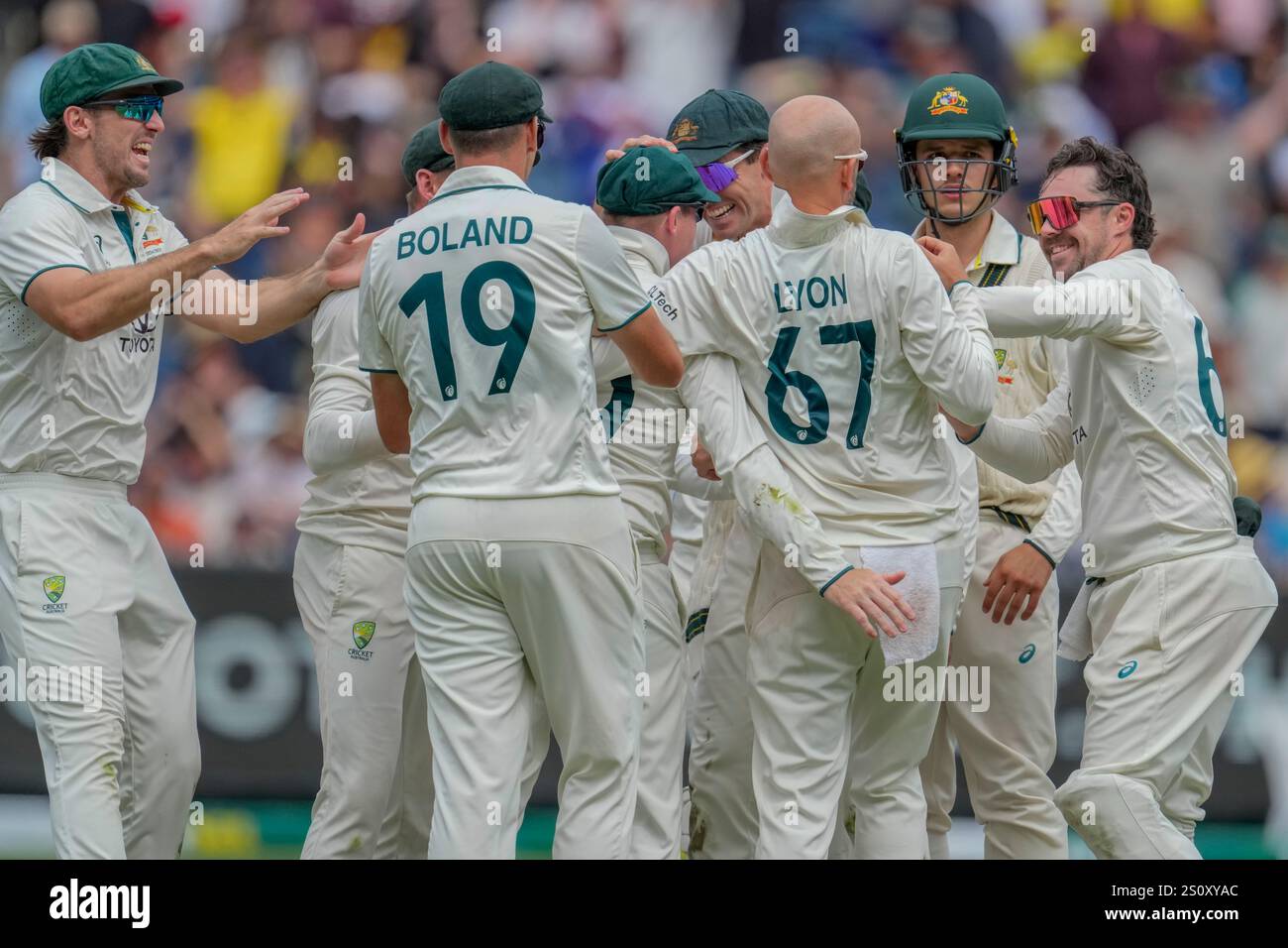 Australia's Nathan Lyon, third right, celebrates with teammates after ...