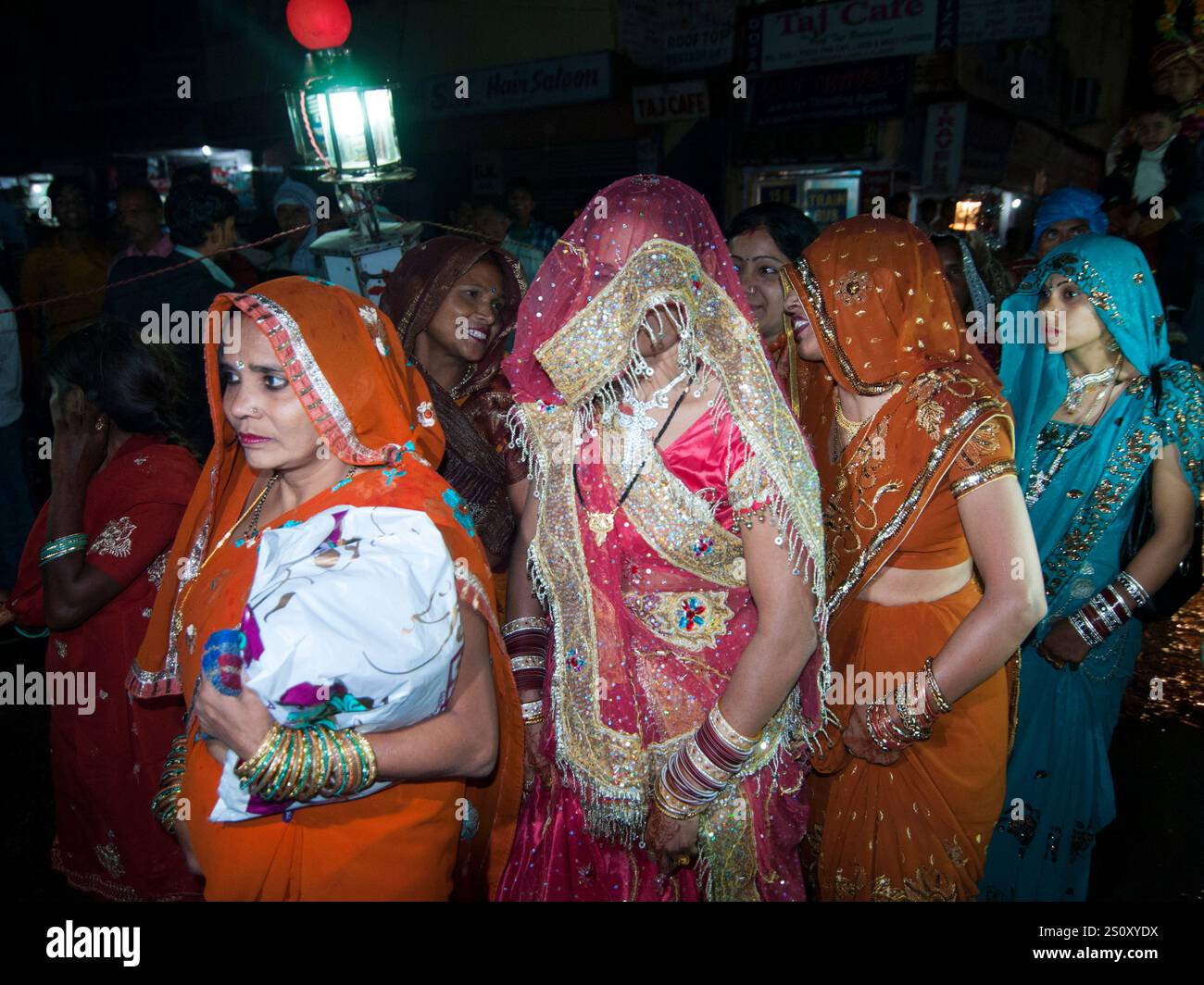 A colorful Indian wedding procession in the streets of Agra, India ...
