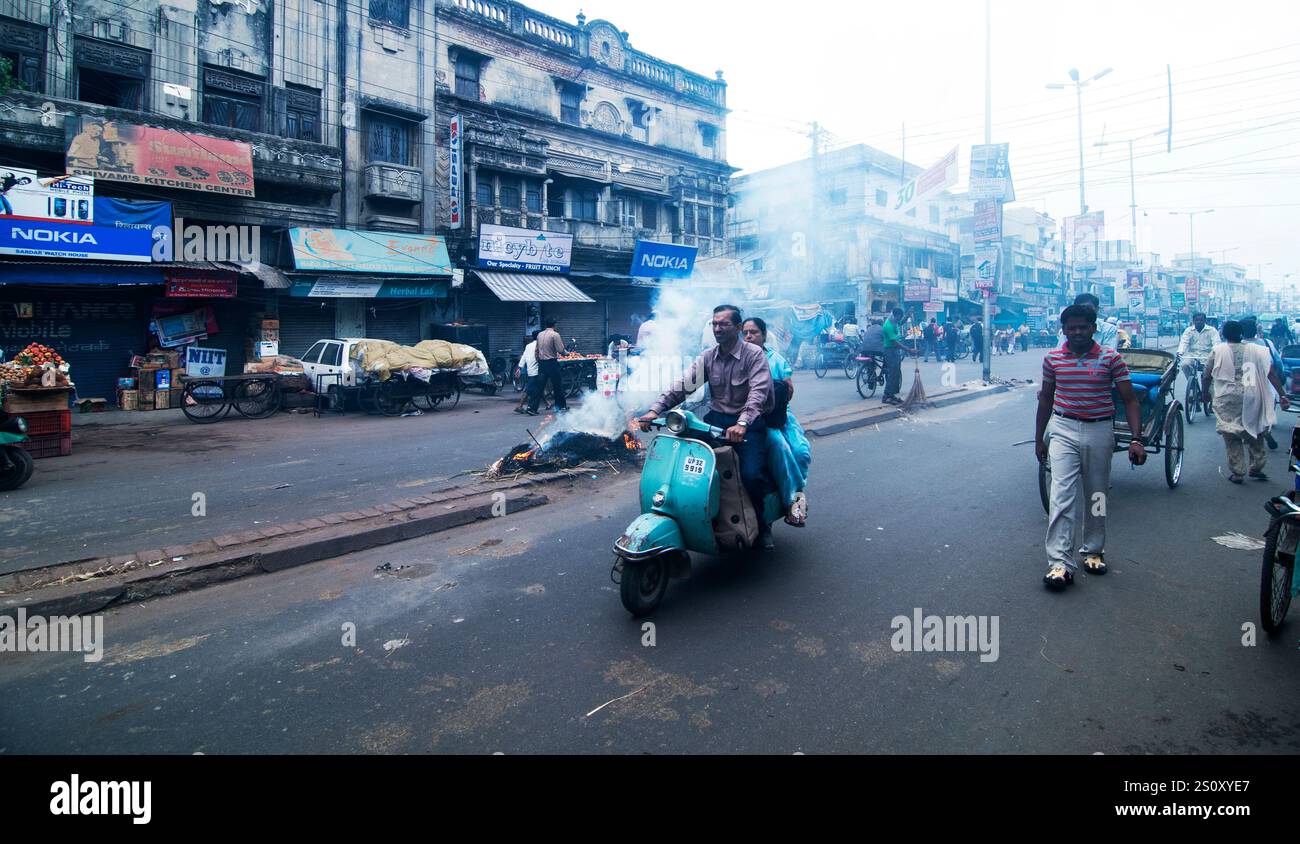 A pile of rubish burning in the middle of the street in Lucknow, India ...